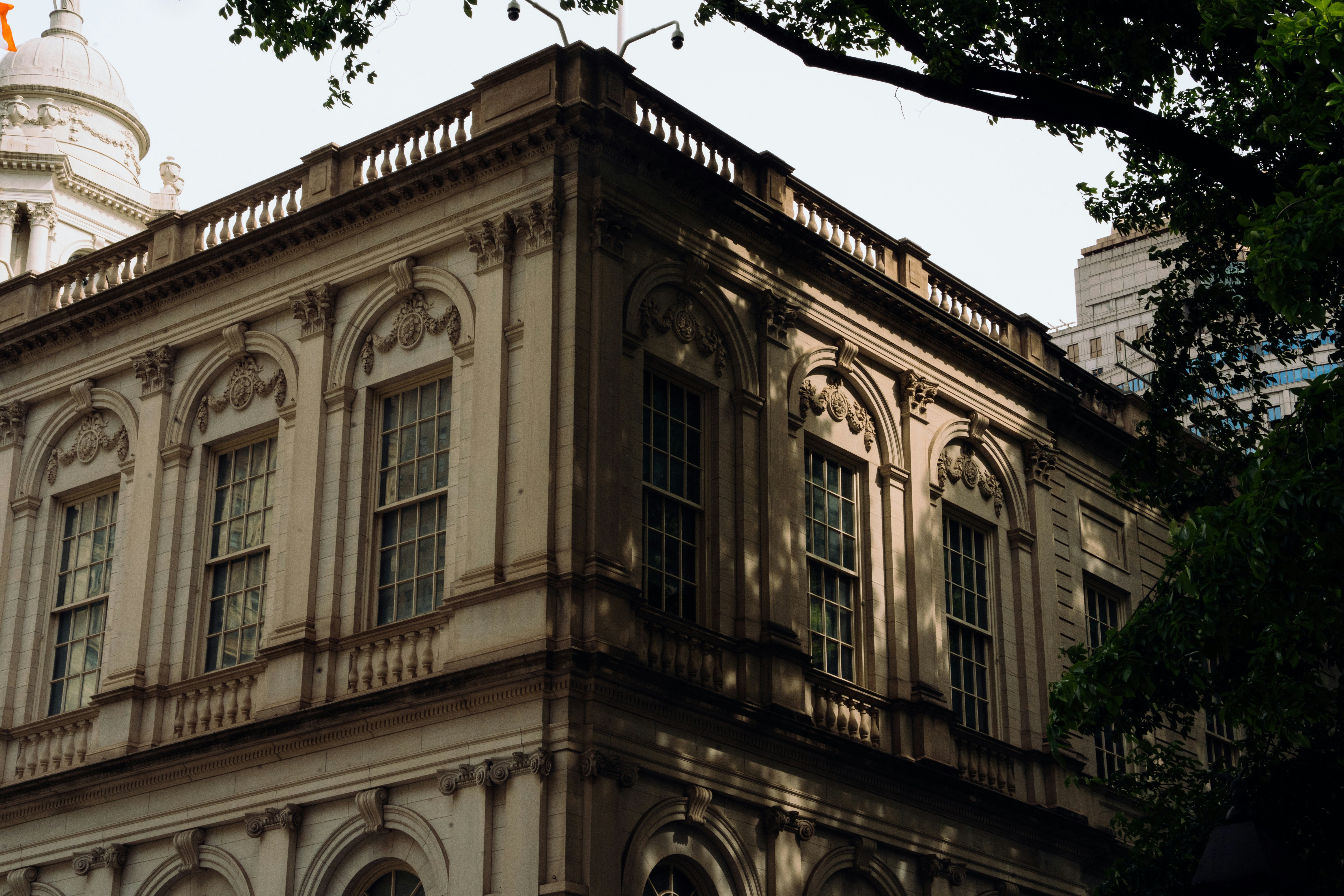 Corner Parapets and Ornamented Facade of a Historic Balcony Building