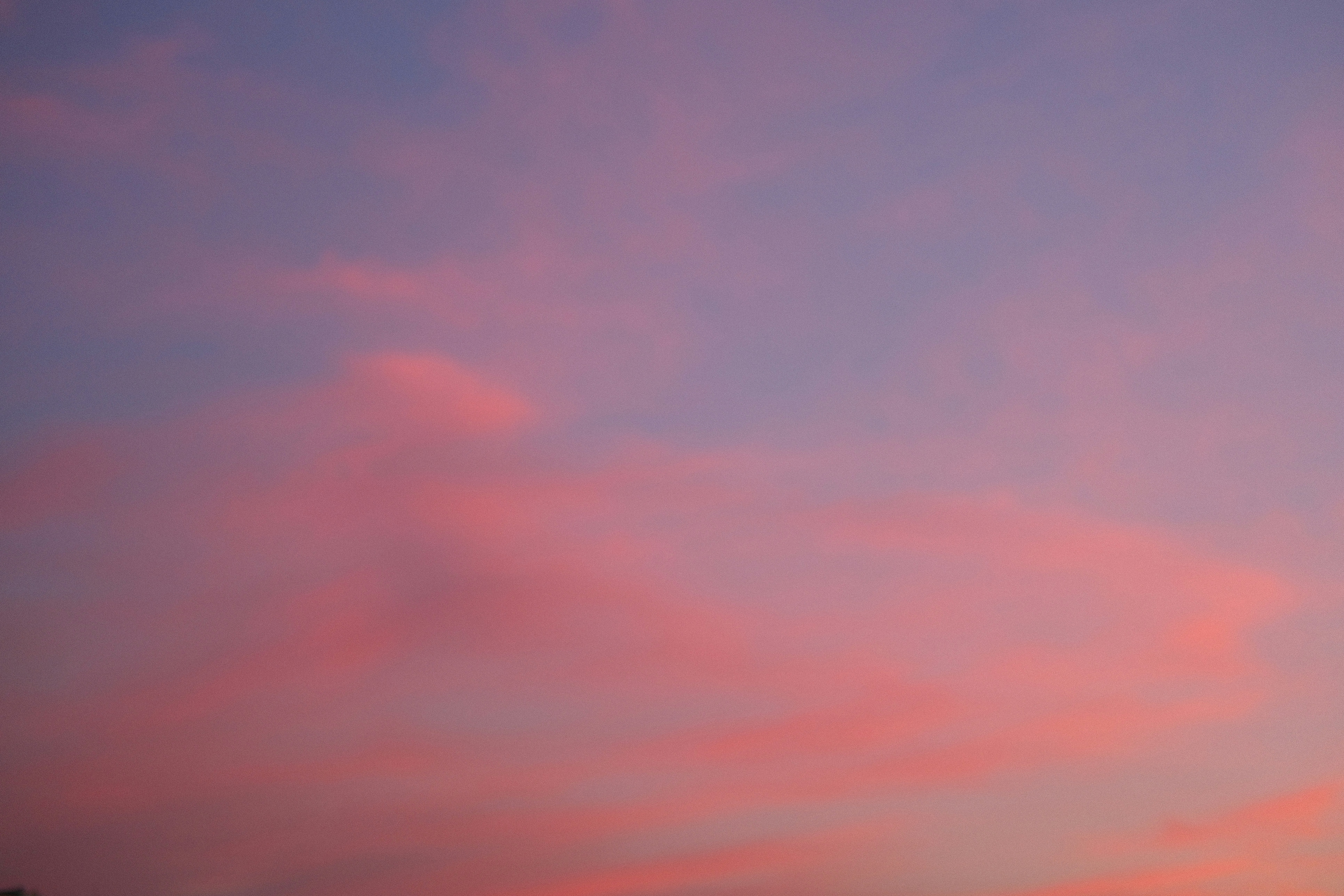 Pink-Orange Sky at Dusk Over Quiet Horizon