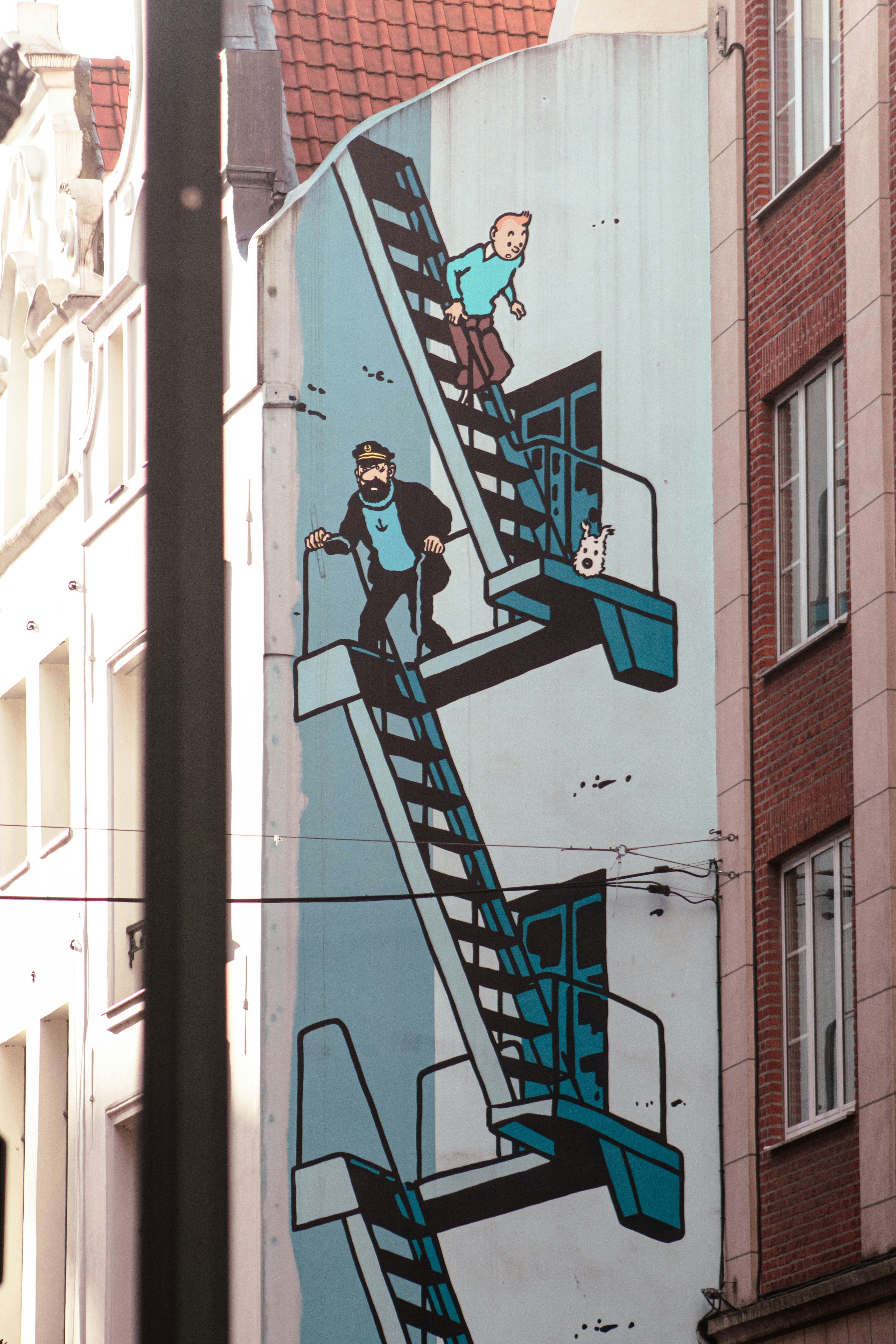 Mural Descent: A Spirited Staircase Tale on Brick