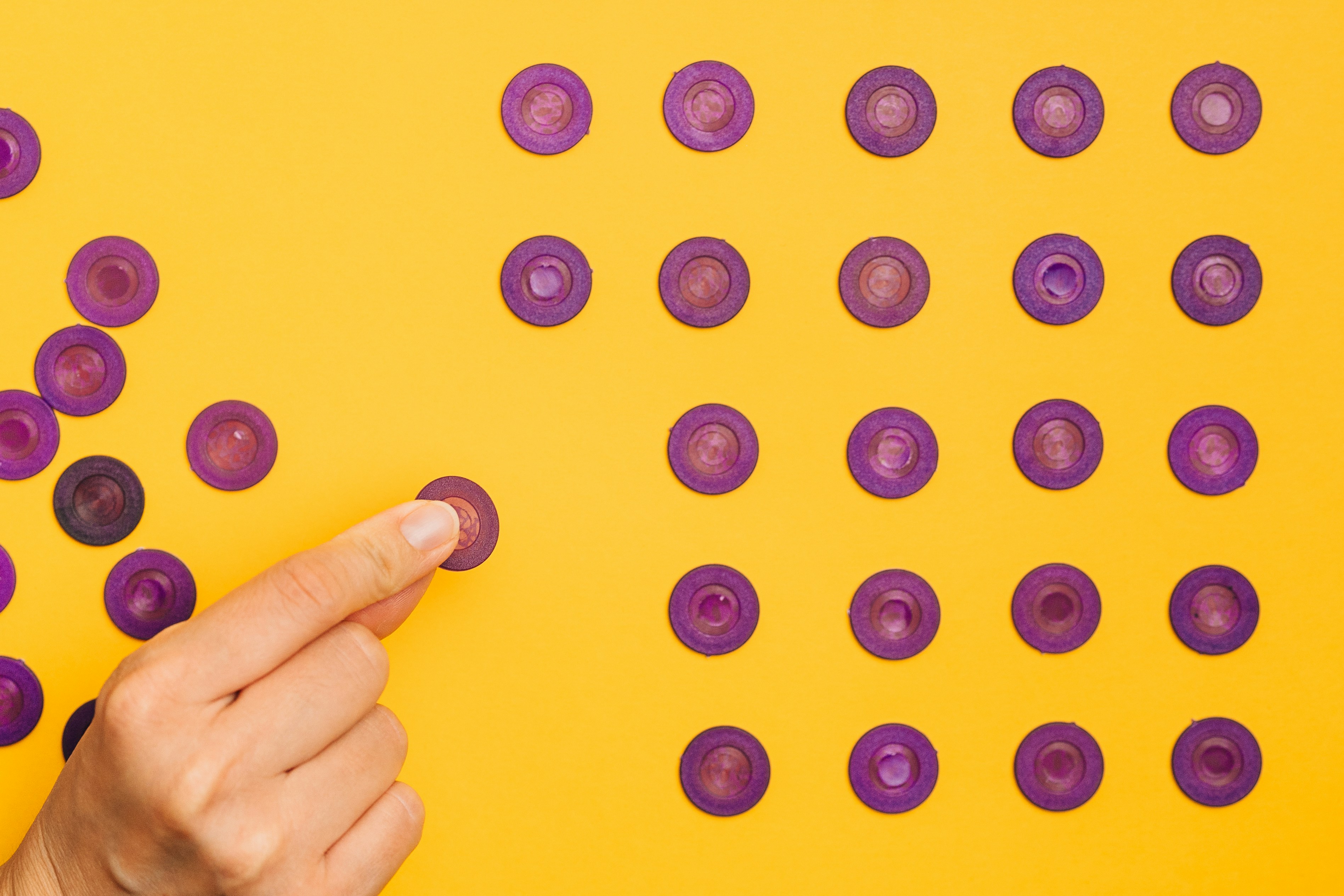 Purple Dots in a Golden Grid: Deliberate Placement on a Bright Canvas