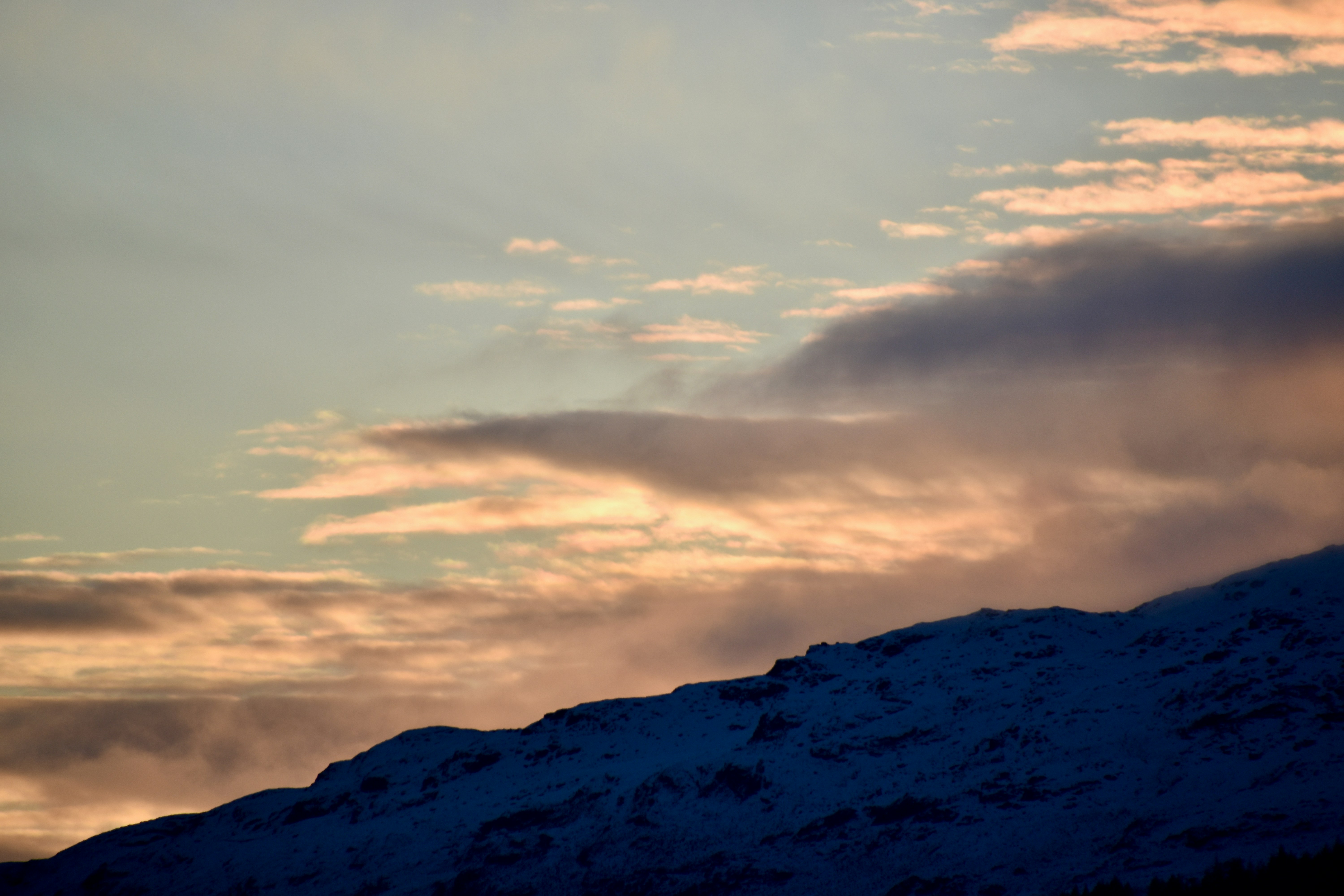 Dawn Glow Over Snowy Ridge