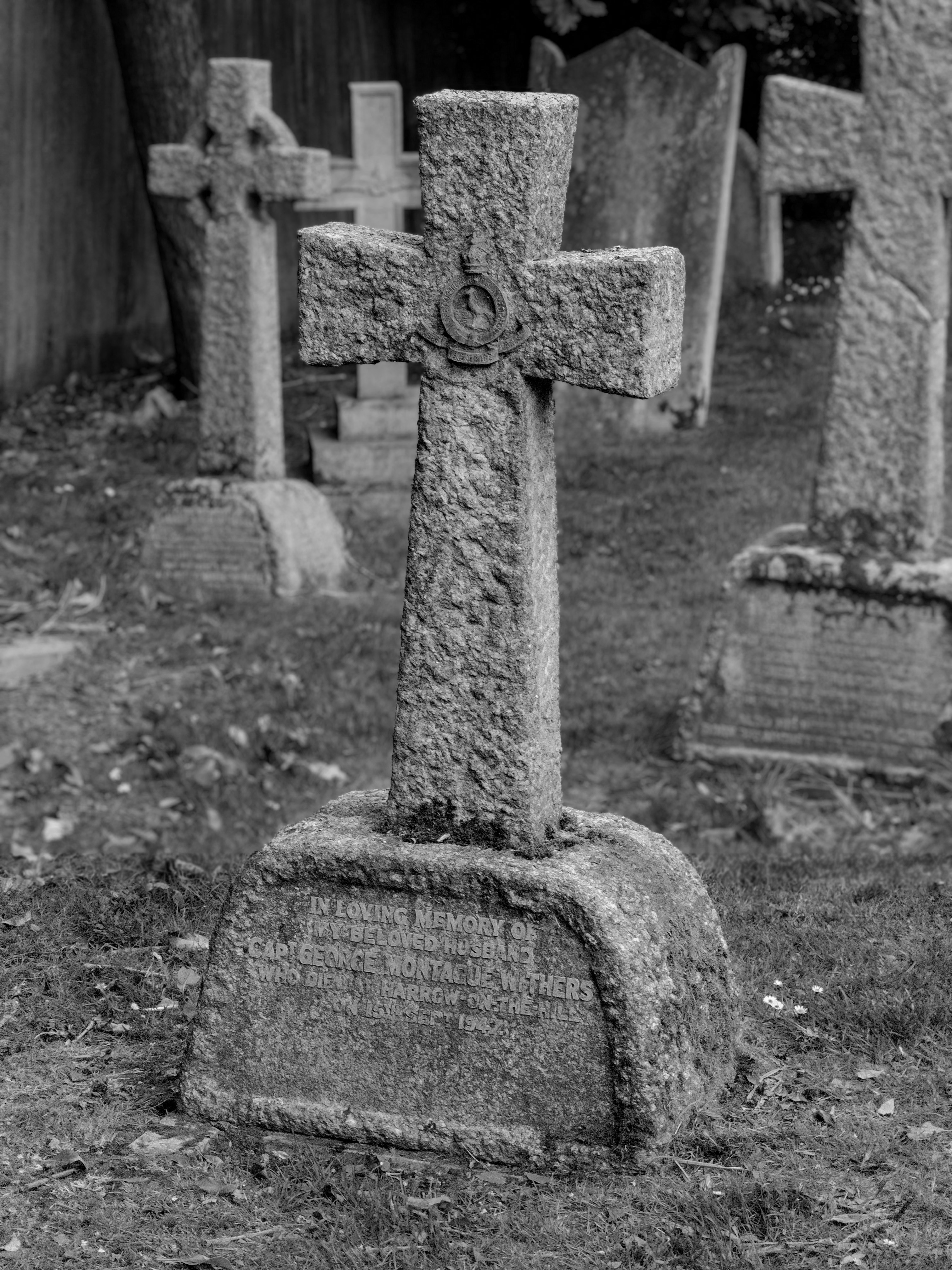 Weathered Cross in a Quiet Cemetery
