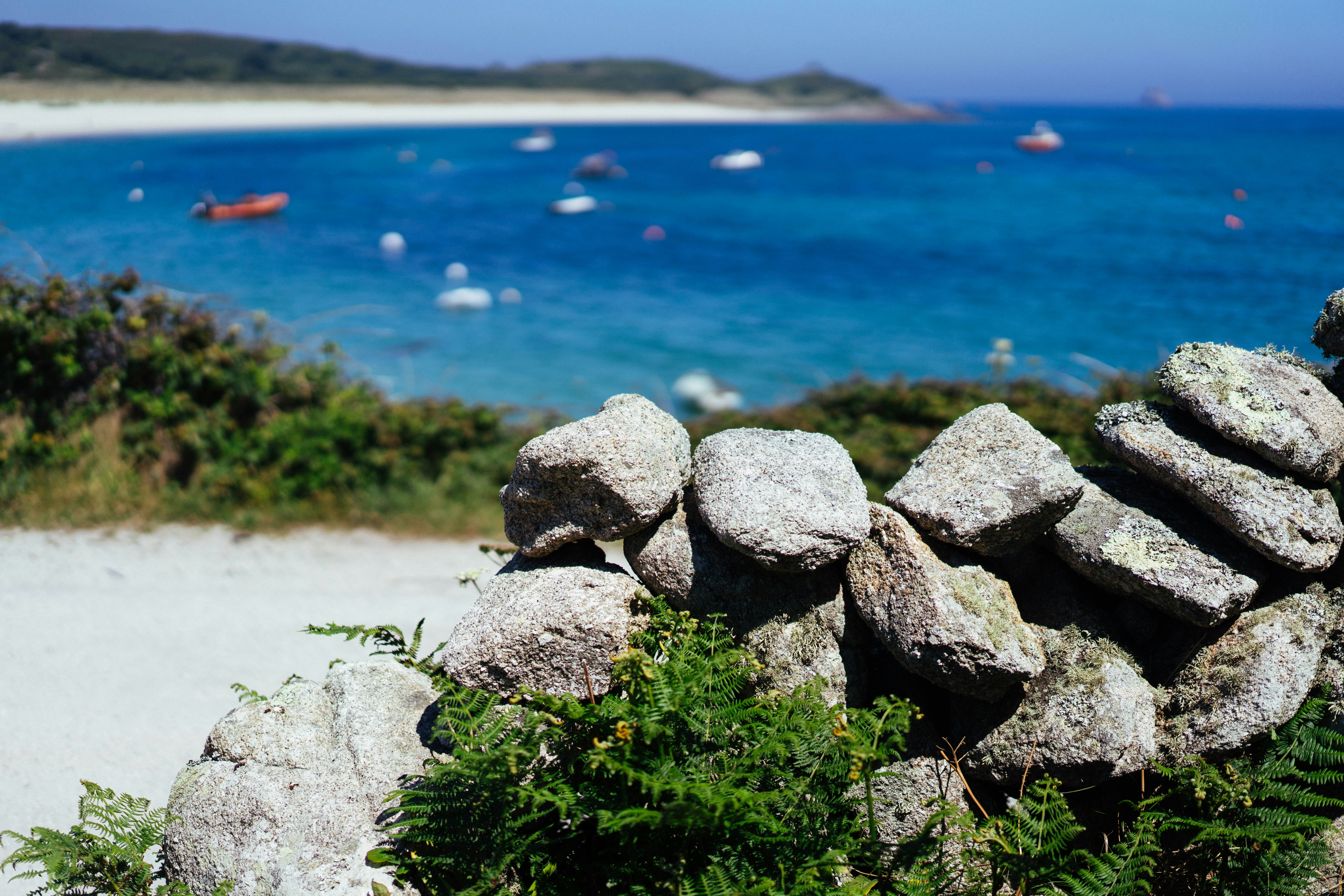 Stone Wall, Sea Breeze: A Quiet Coastal Masonry in the Sun
