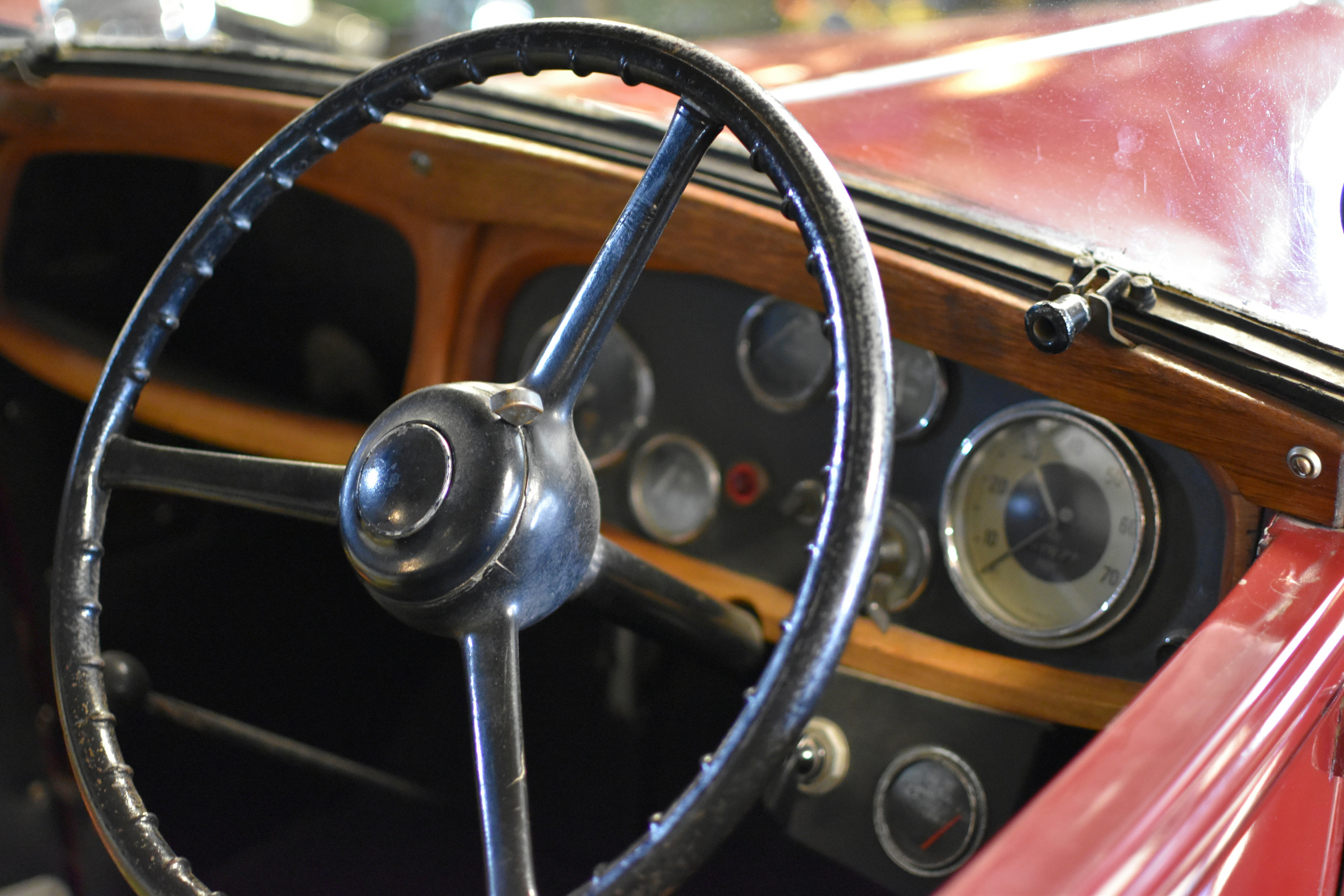 Vintage Red Dash: A Steeped Glimpse into Classic Car Cockpit