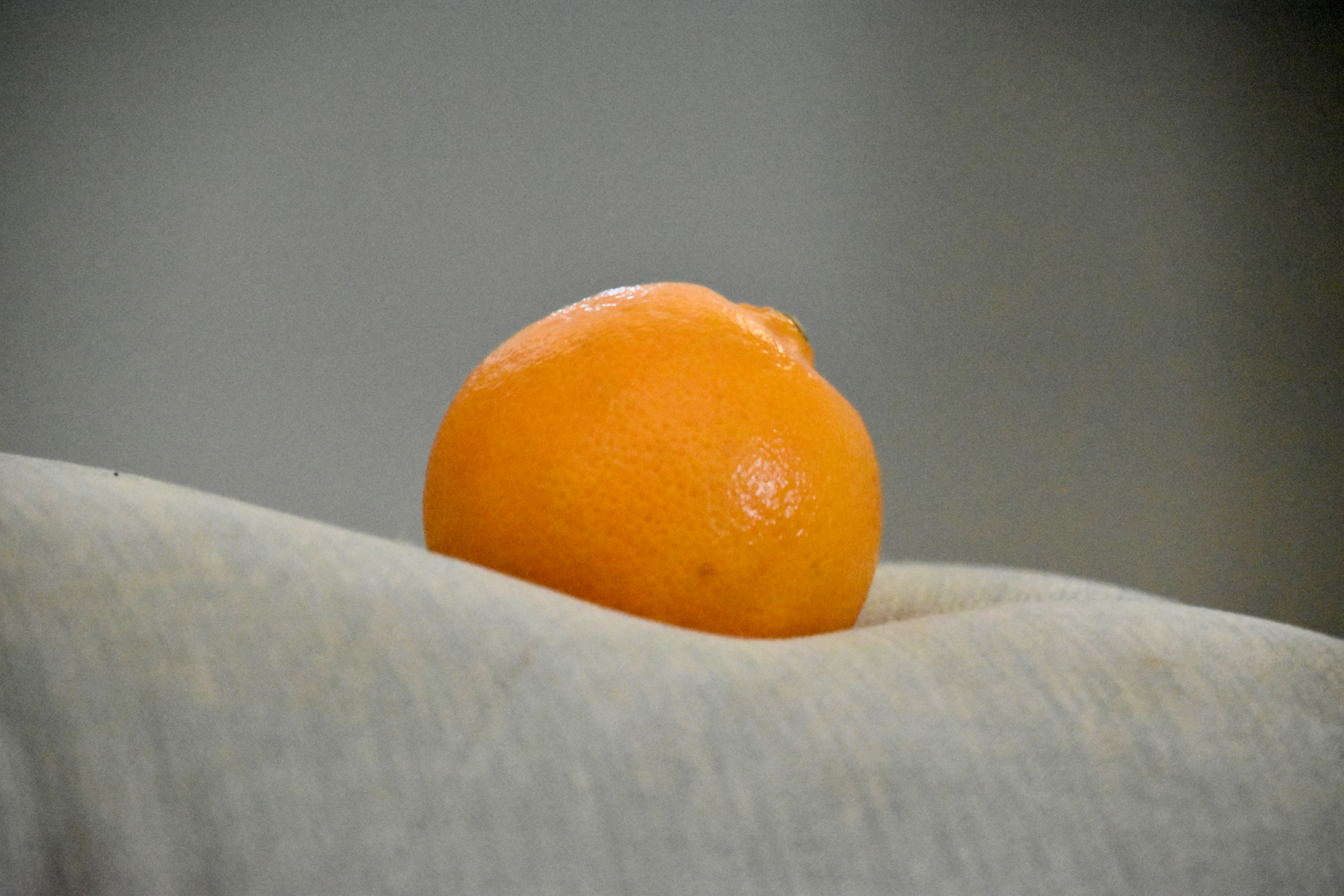 Orange on Soft Linen: A Quiet Pop of Color