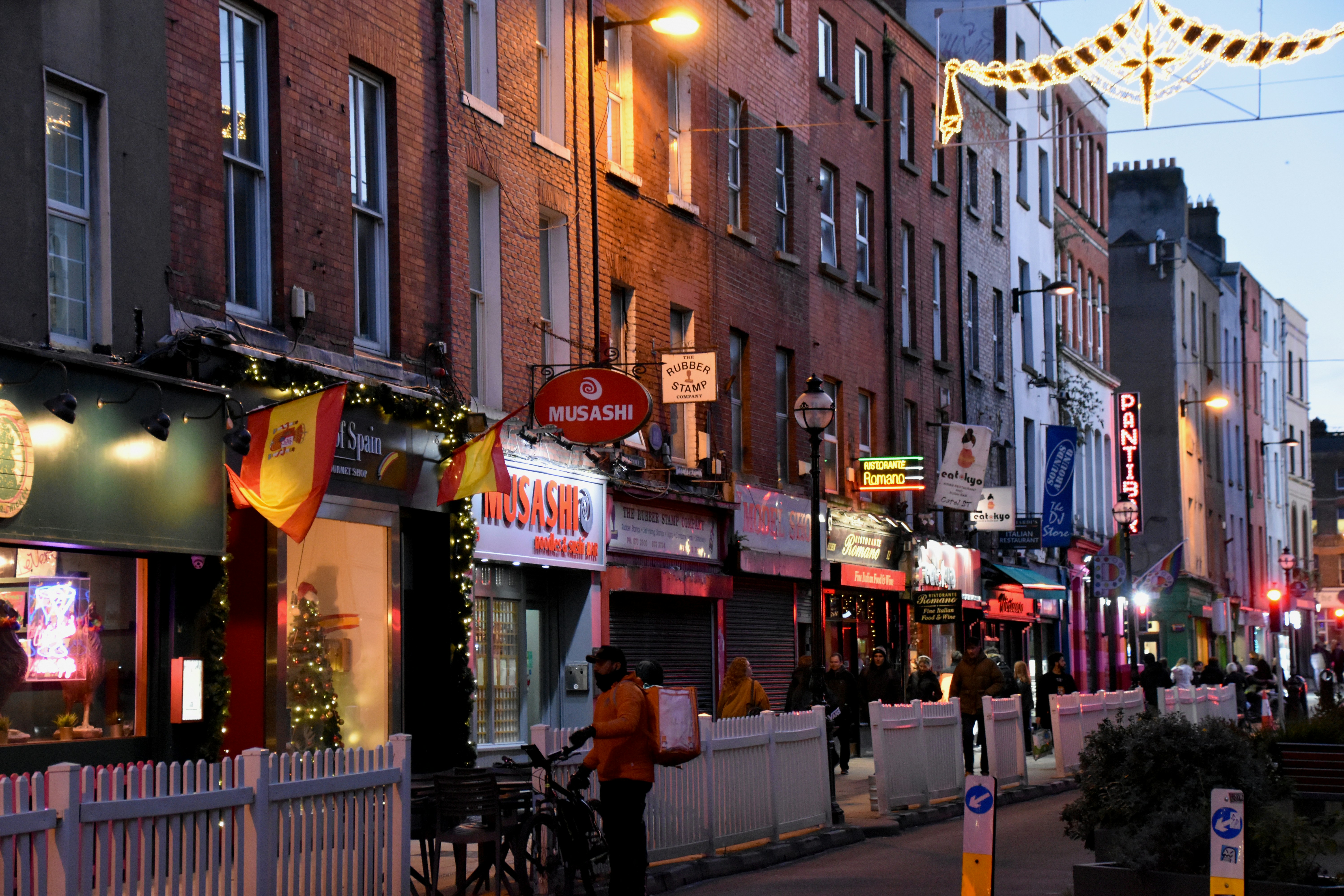 Evening Neon on Irish Street: A Cozy Urban Nightlife Scene