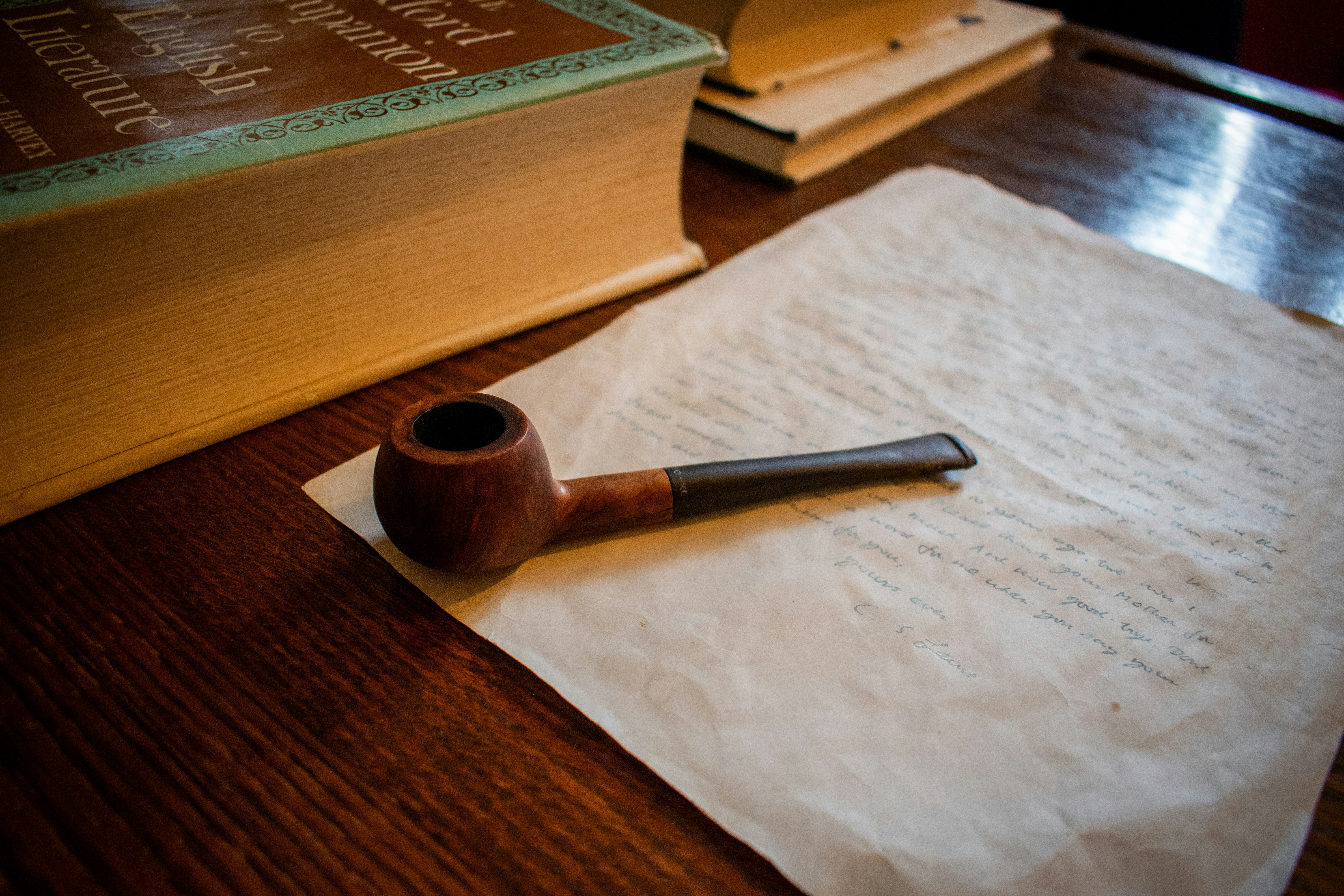 A Quiet Study Nook: Pipe, Paper, and a Tidy Stack