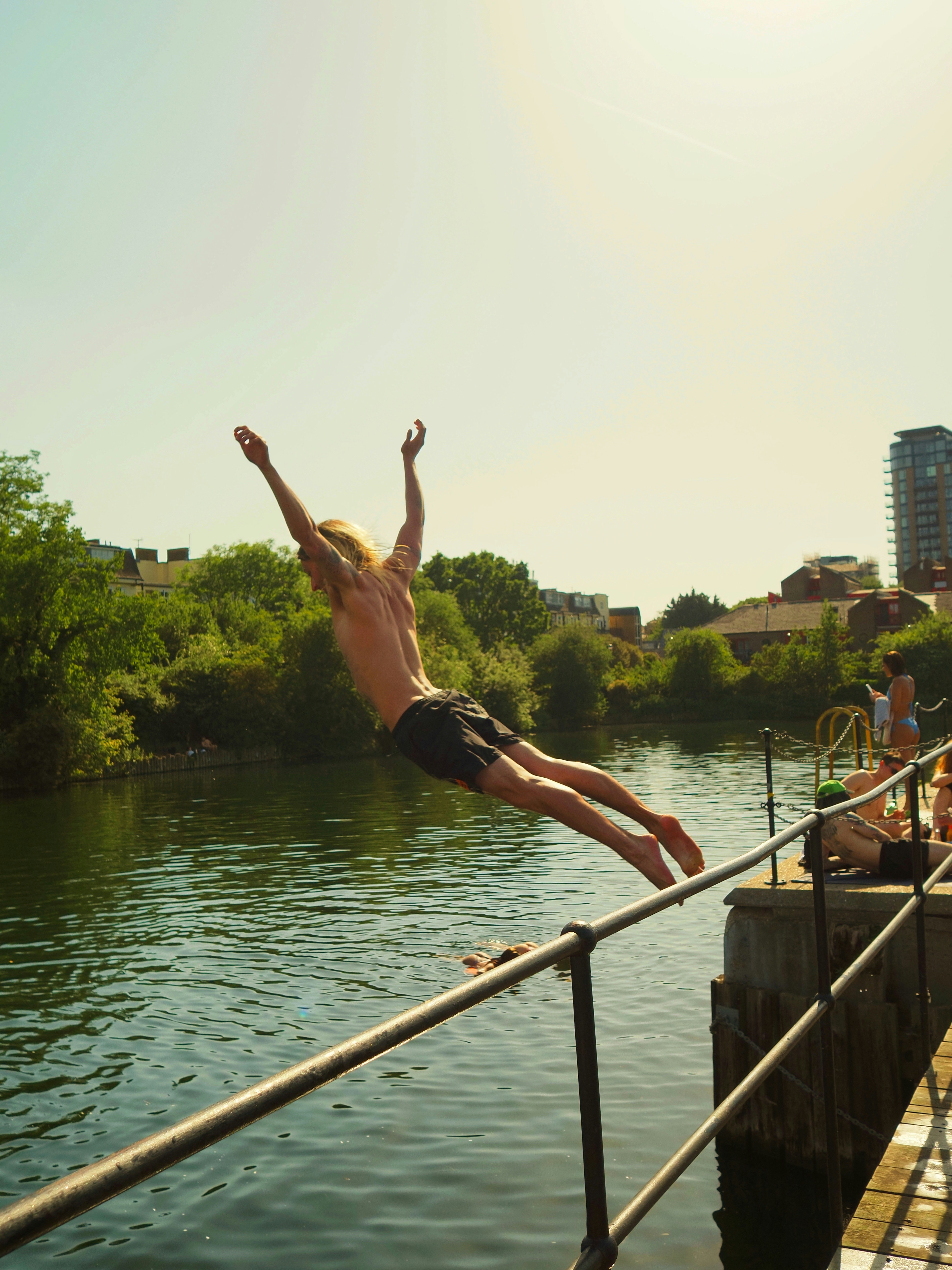 Mid‑air Leap Over the Riverside Rail