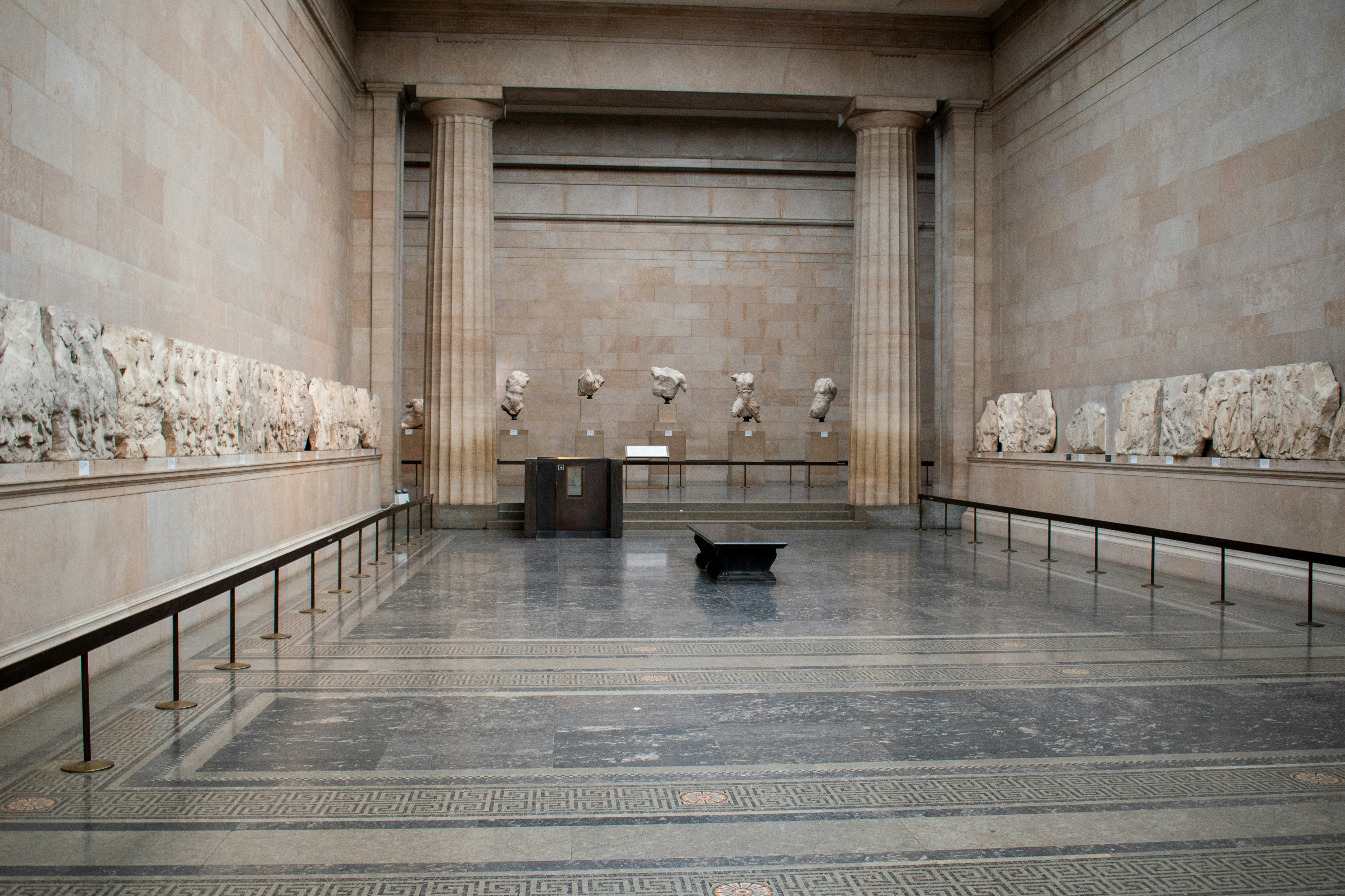 The Quiet Atrium: A Row of Sculpted Busts Above an Empty Pool