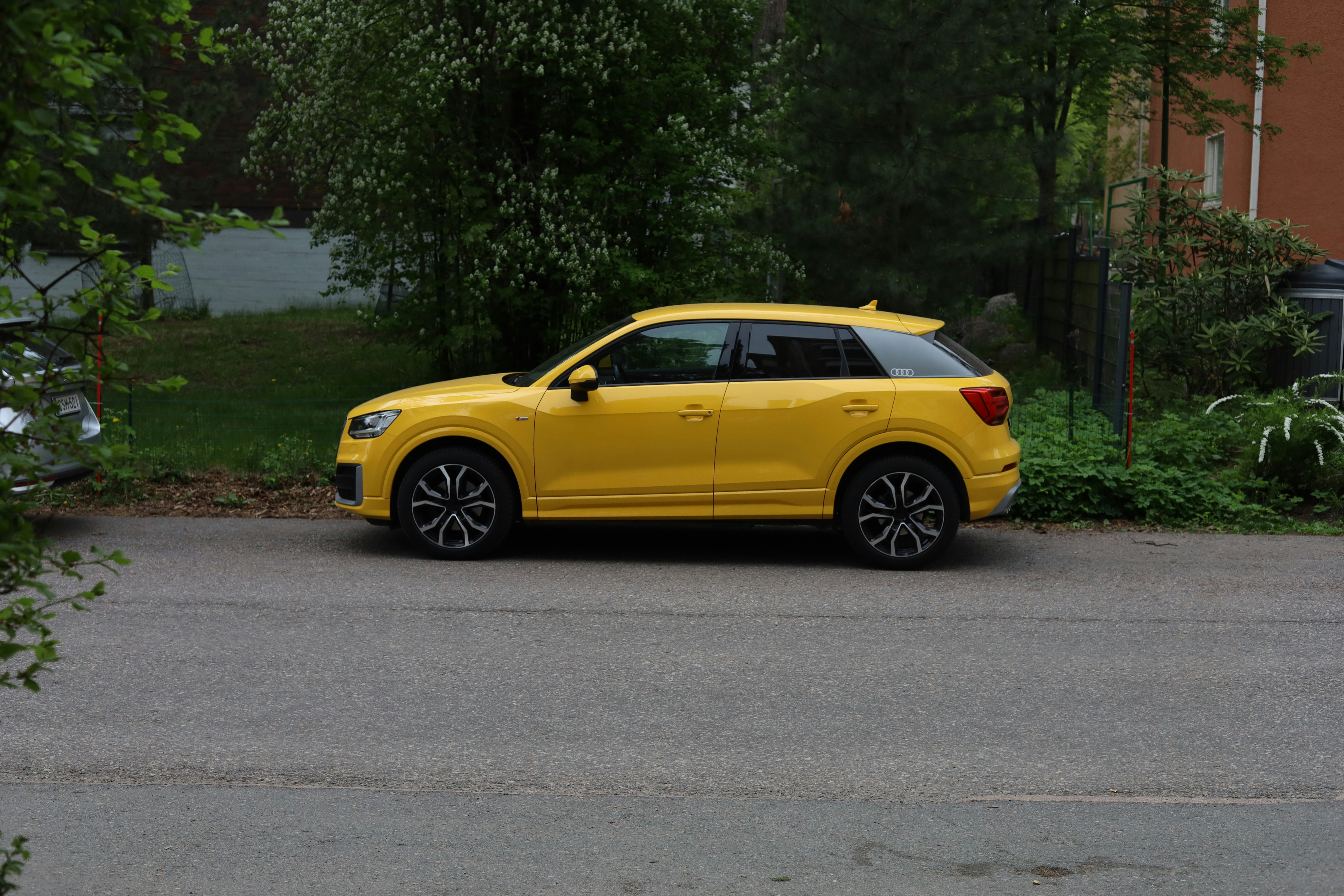Yellow SUV as Center Stage on Quiet Street