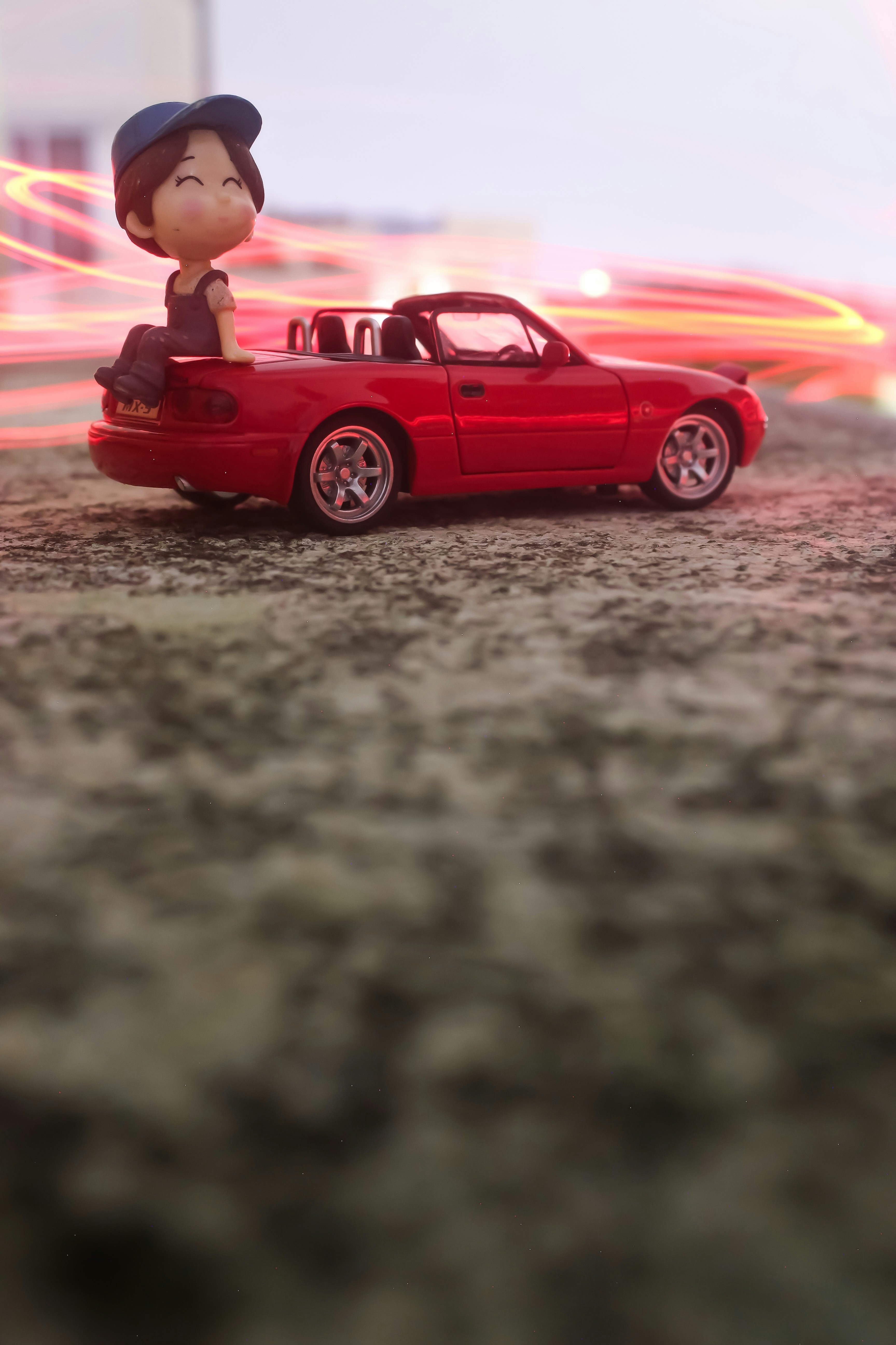 Mini Convertible, Big Dreams: A Tiny Figurine at the Wheel