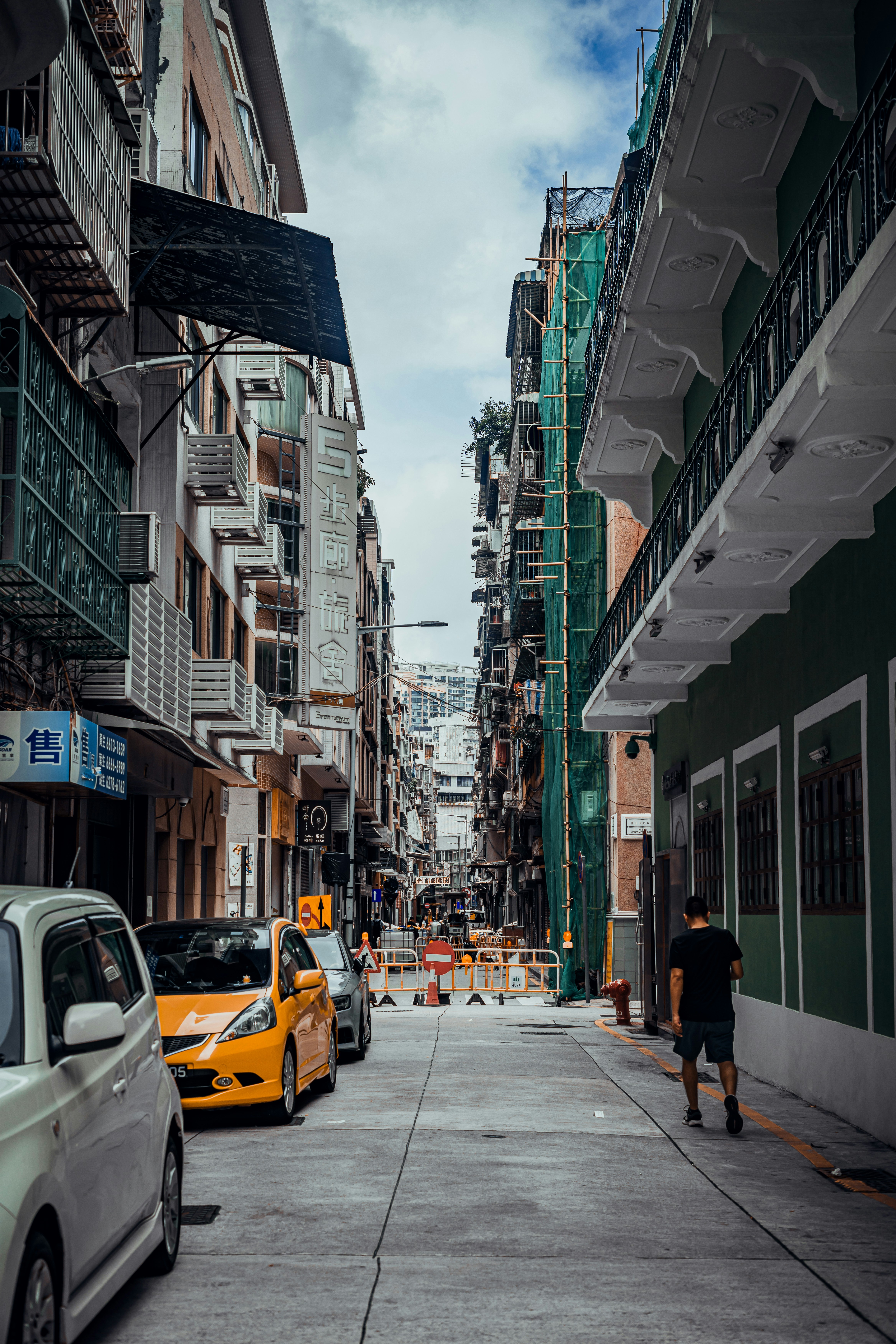 Urban Corridor: A Quiet Street Amid City Construction