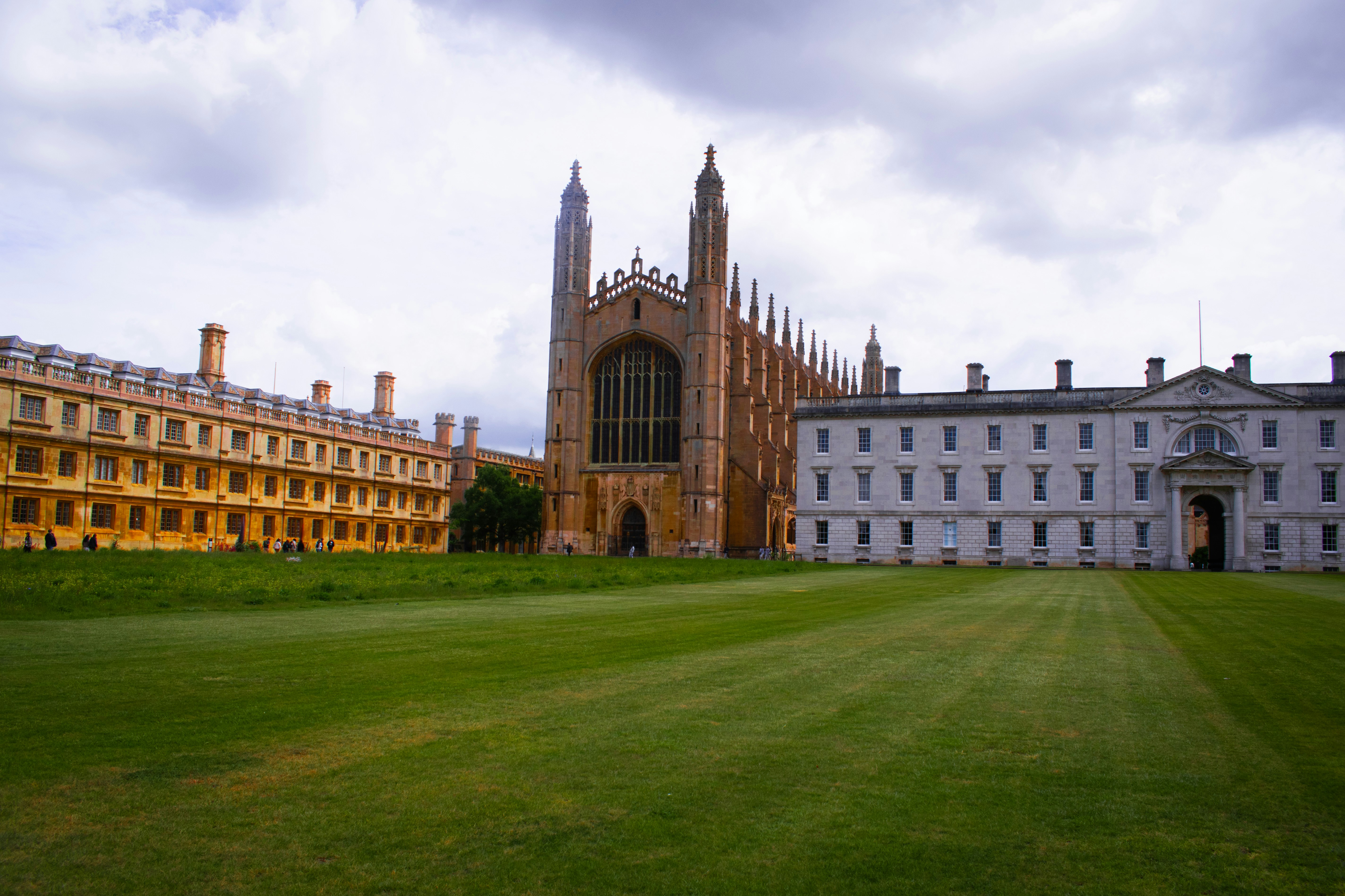 Cathedral façade and courtyard beyond a manicured lawn