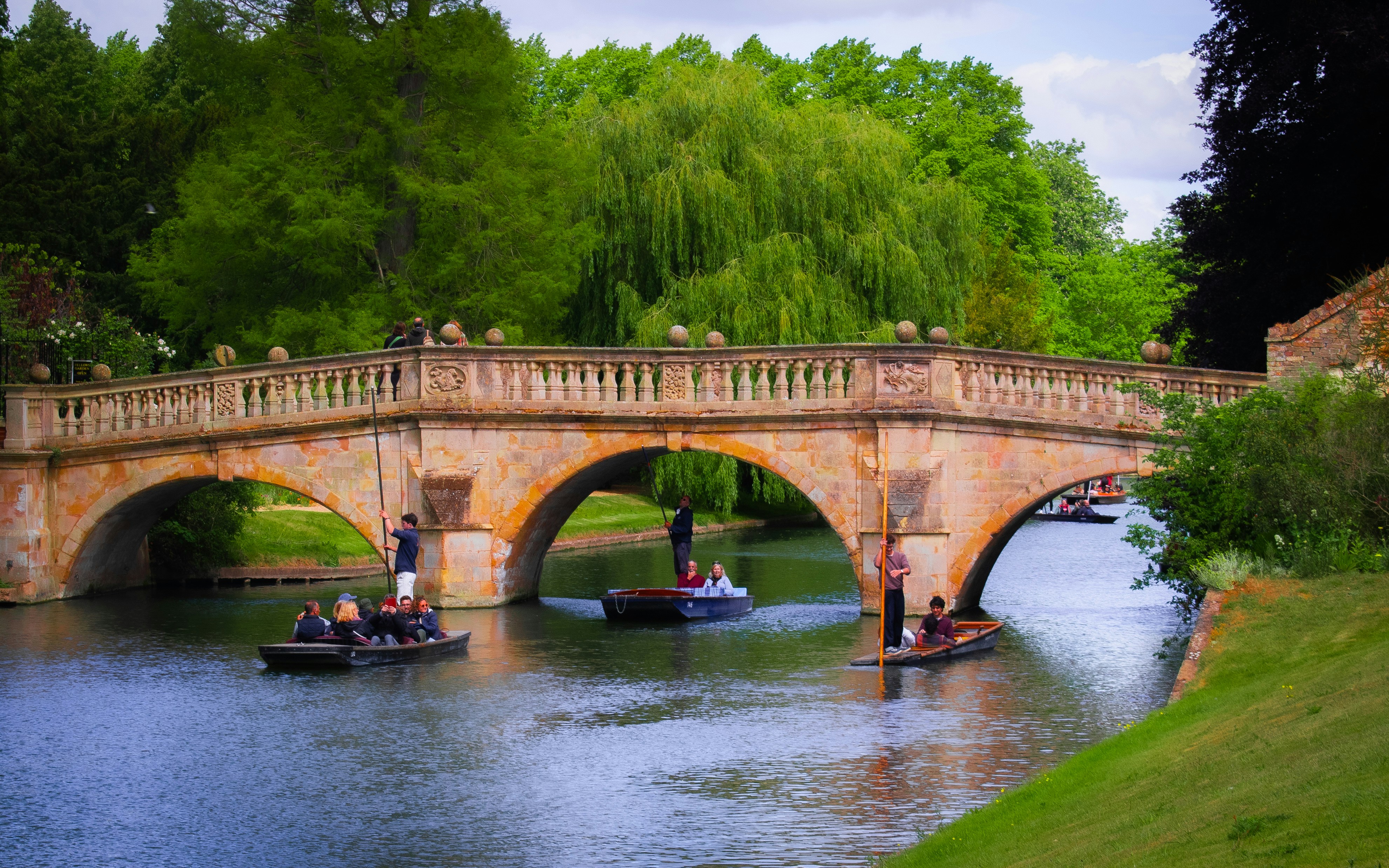 Pedalling Past by the Stone Arc