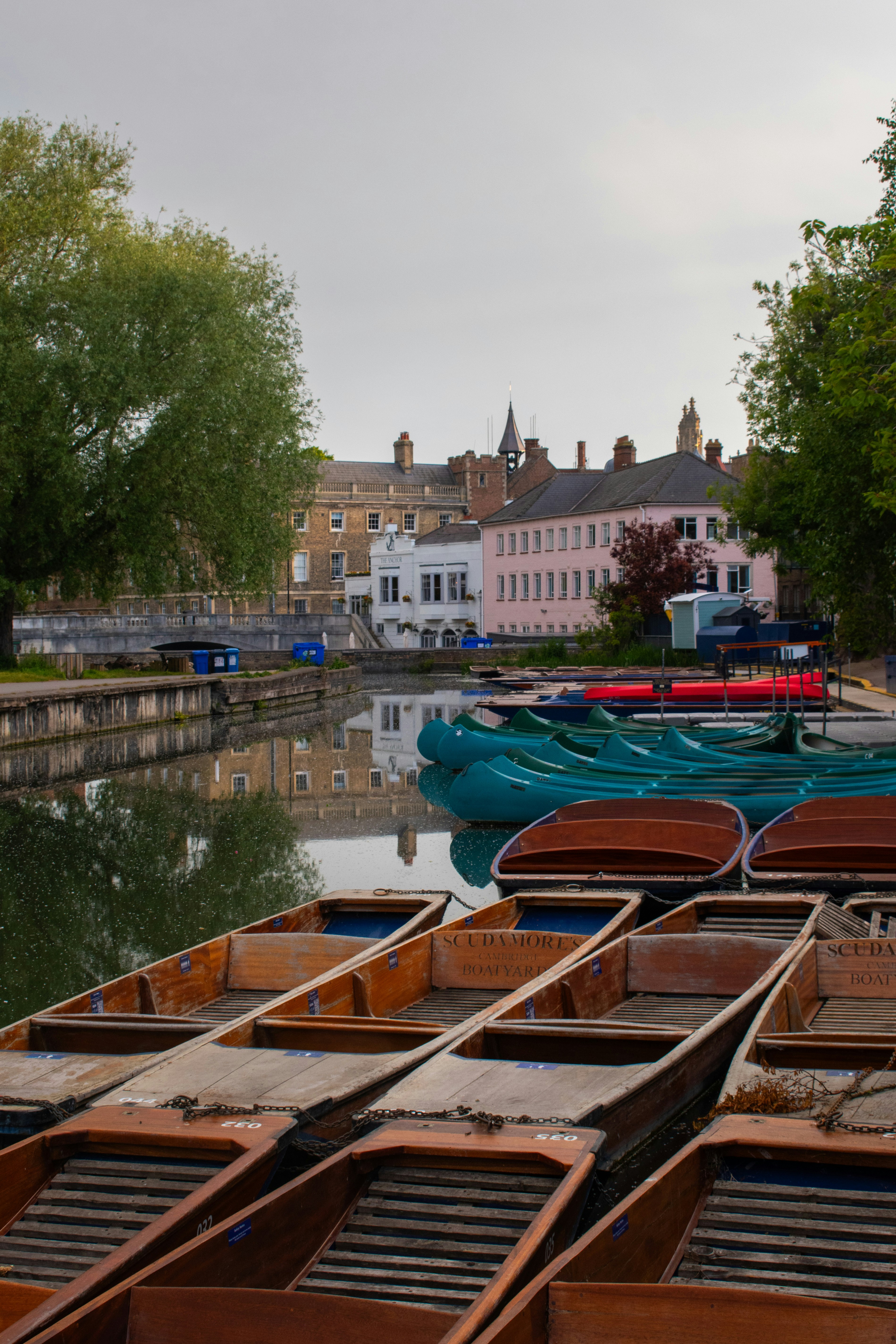 Boats Rest Along a Quiet Riverside Canal