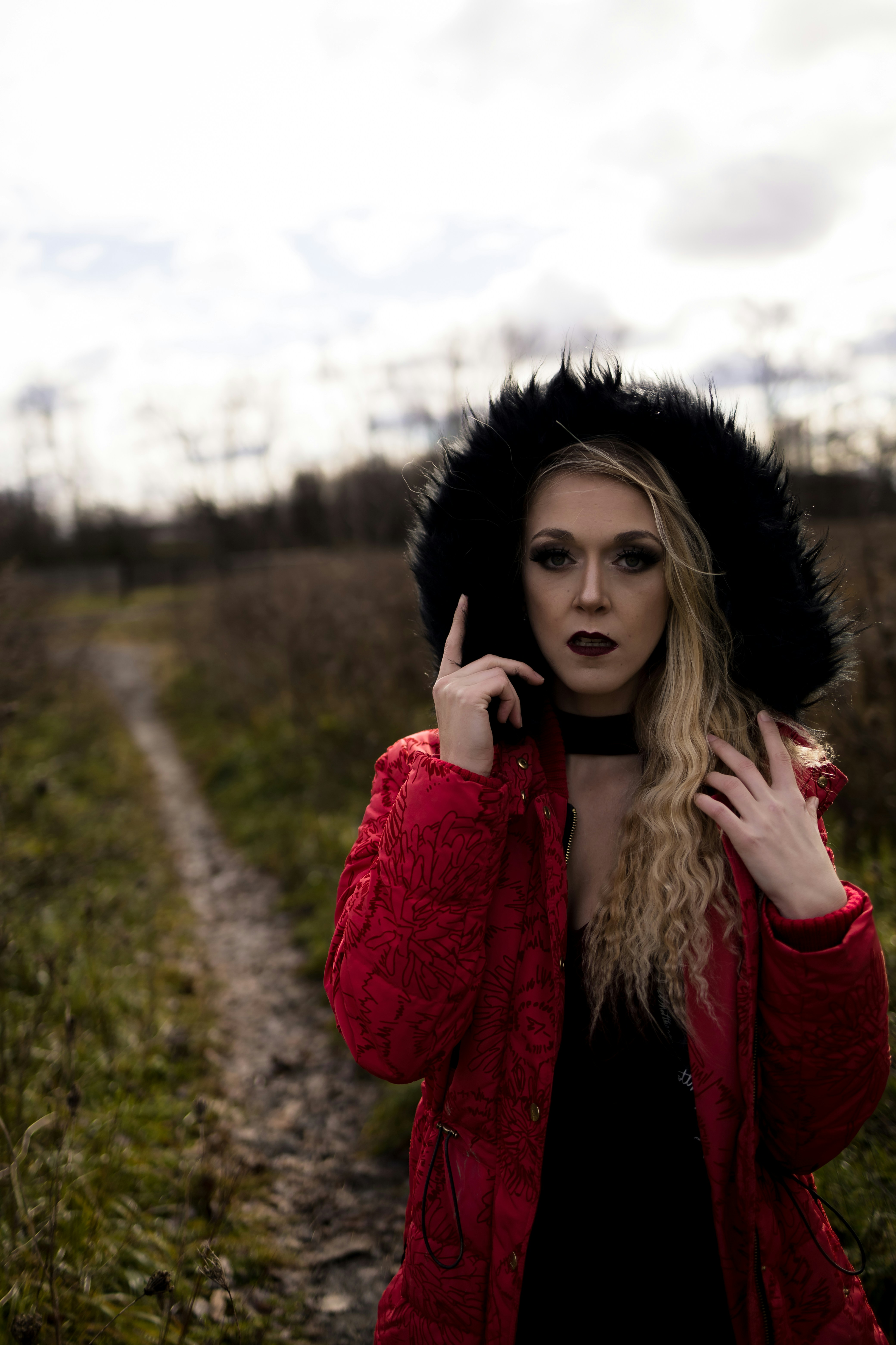 Midwinter Portrait: The Red Coat in the Quiet Field