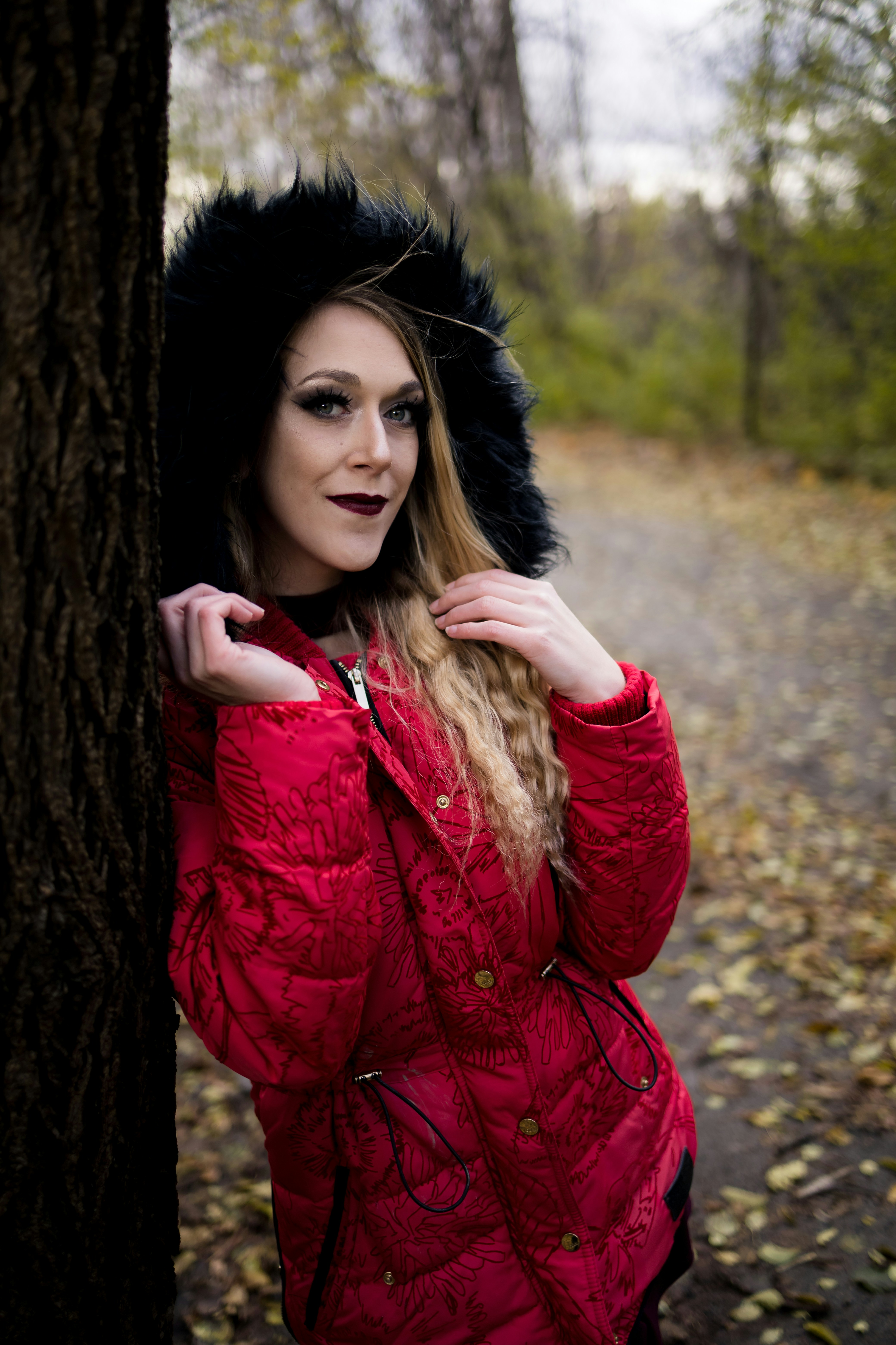 Autumn Portrait by the Tree: Scarlet Jacket at Dappled Edge of the Path
