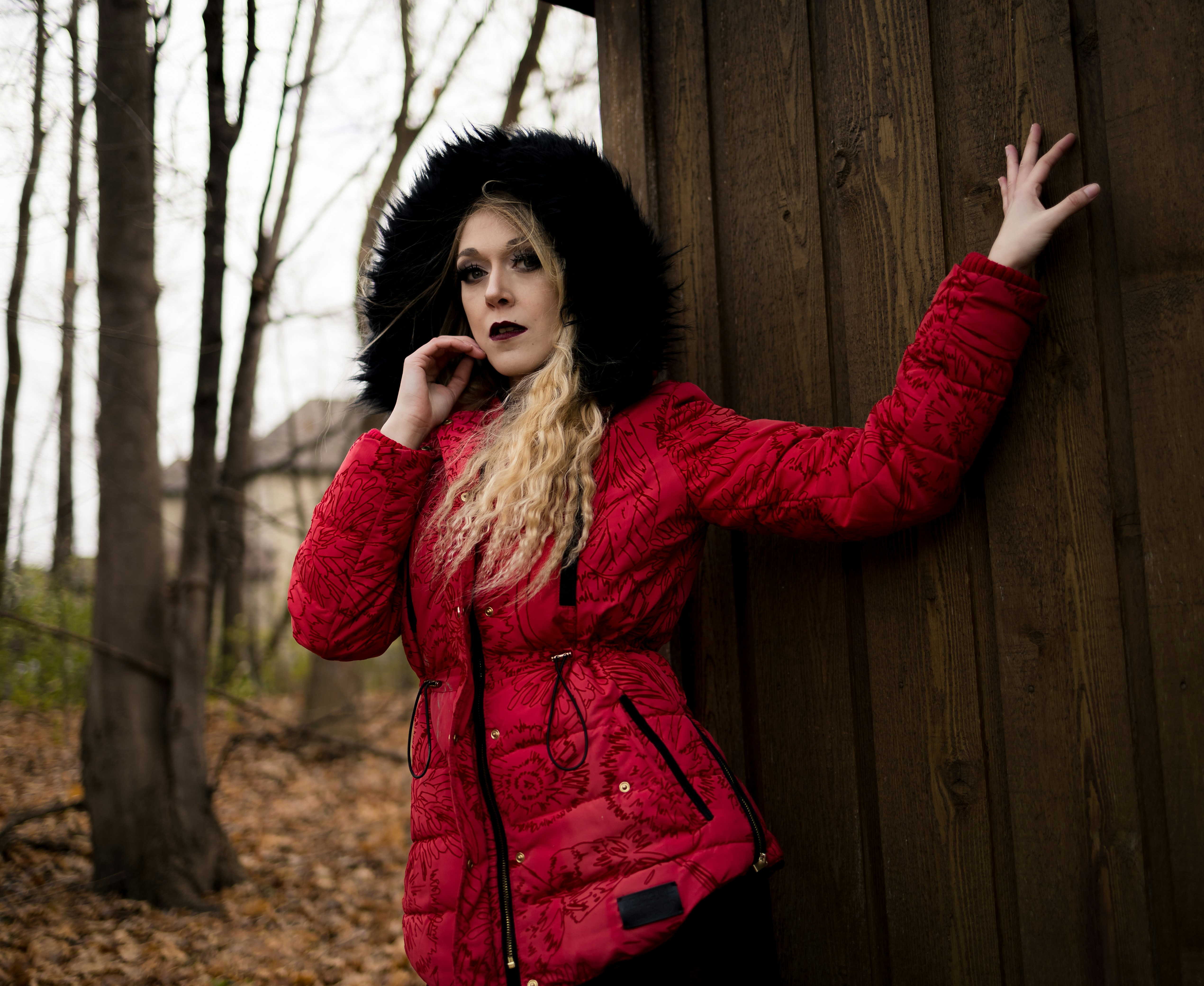 Red Winter Portrait: A Woman in a Textured Crimson Coat