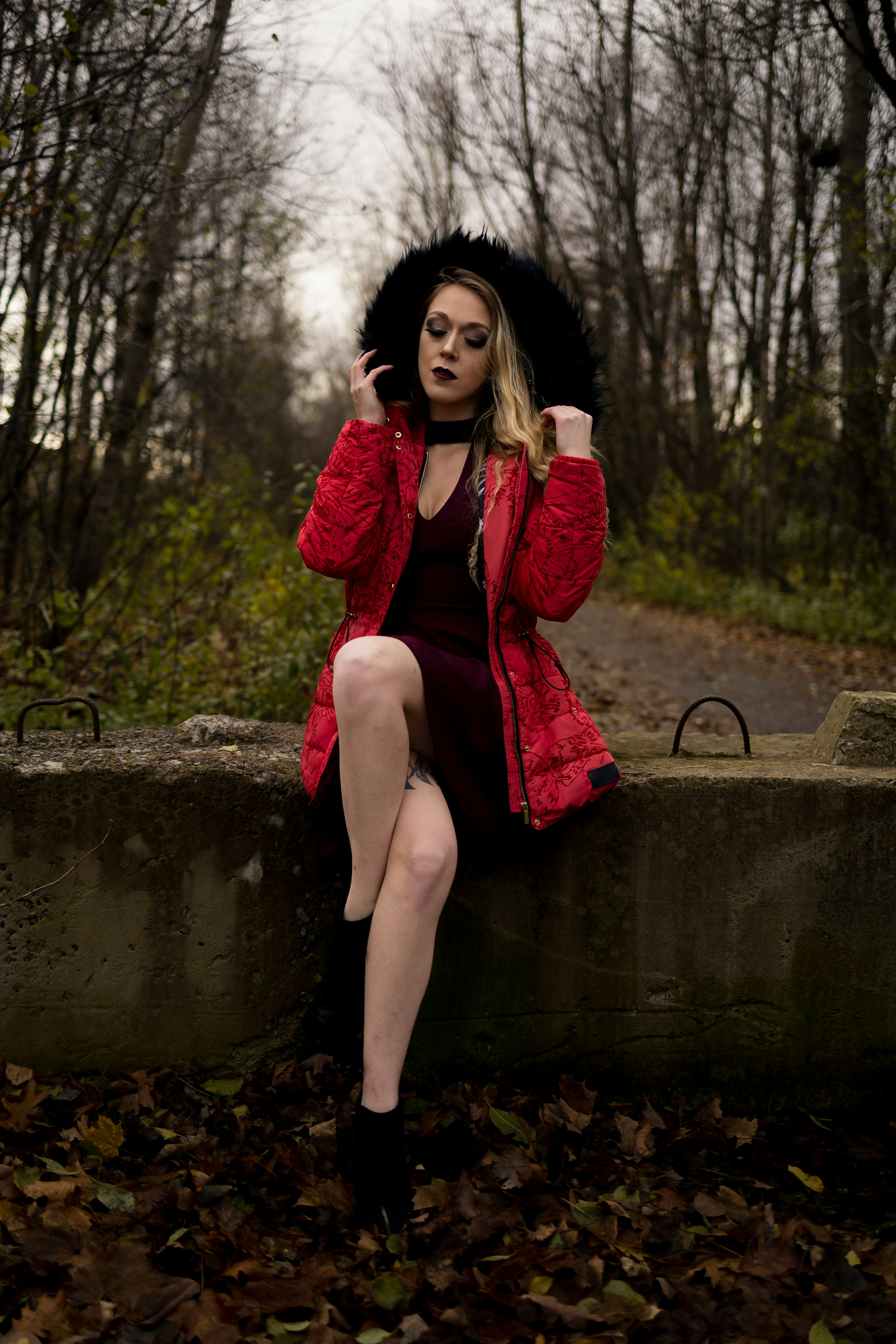 Red Coat in the Quiet Forest: A Moment of Solitude