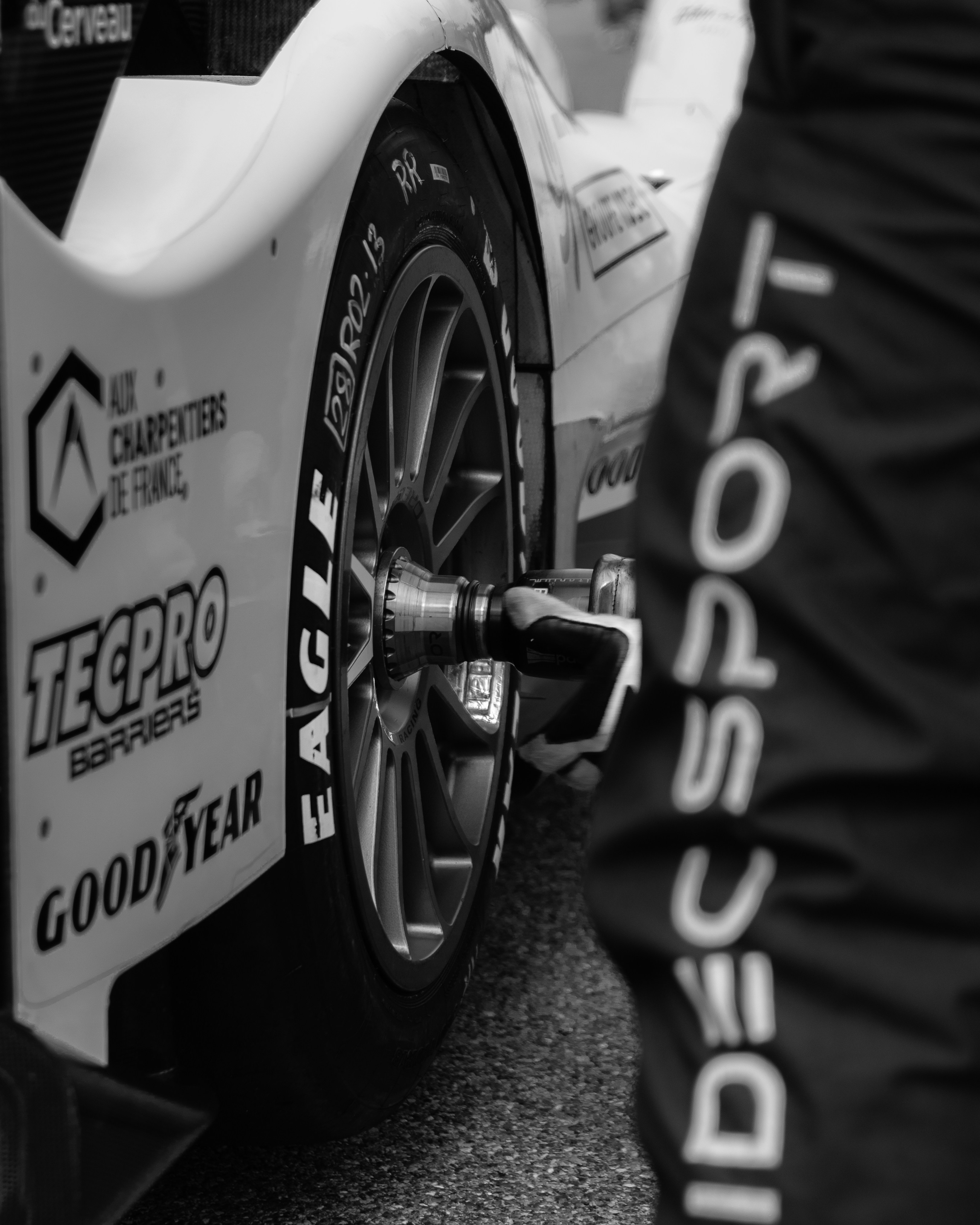 Trackside detail: the torque of a race car wheel in the pit