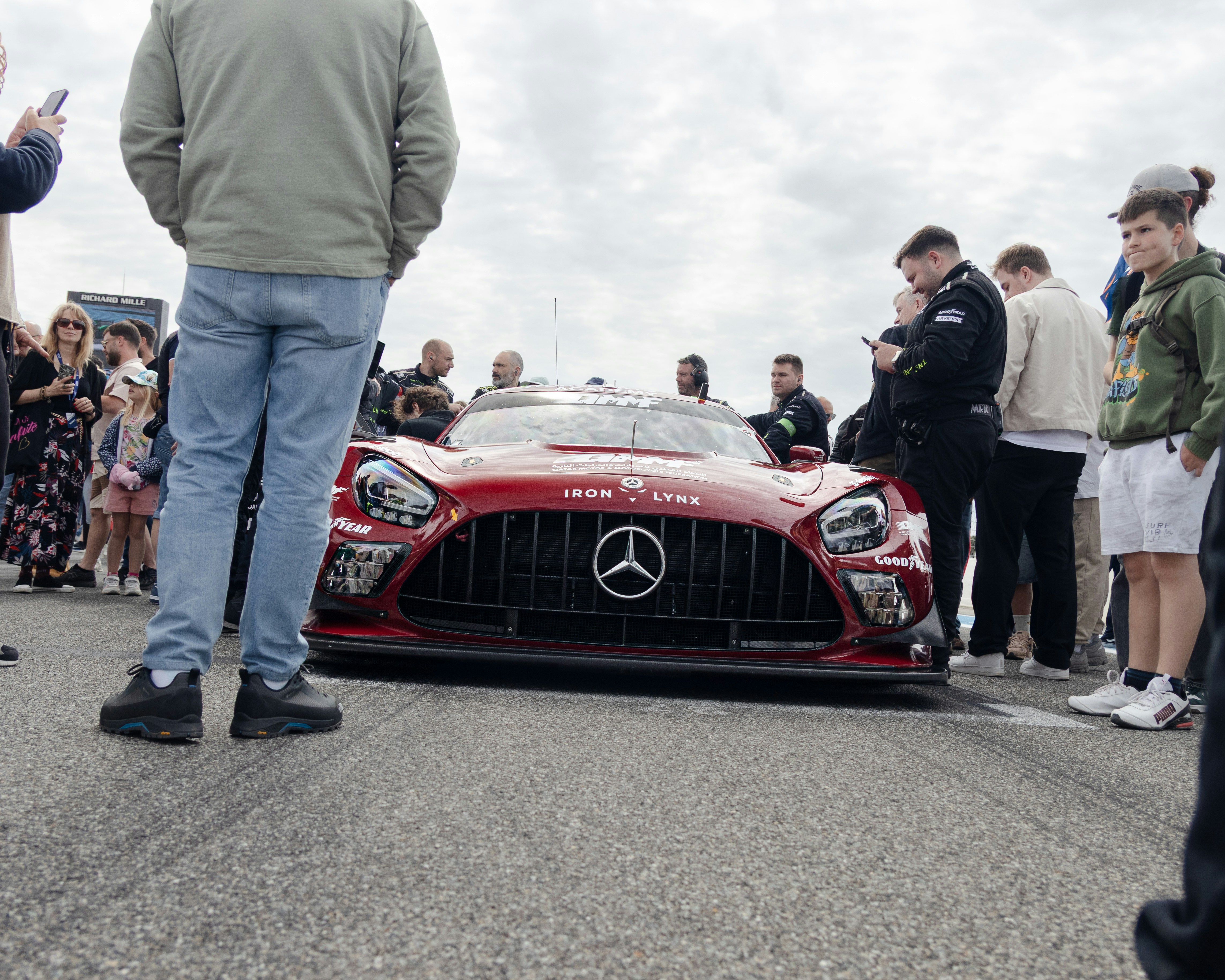 Scarlet Stance: the AMG Mercedes prowls between spectators