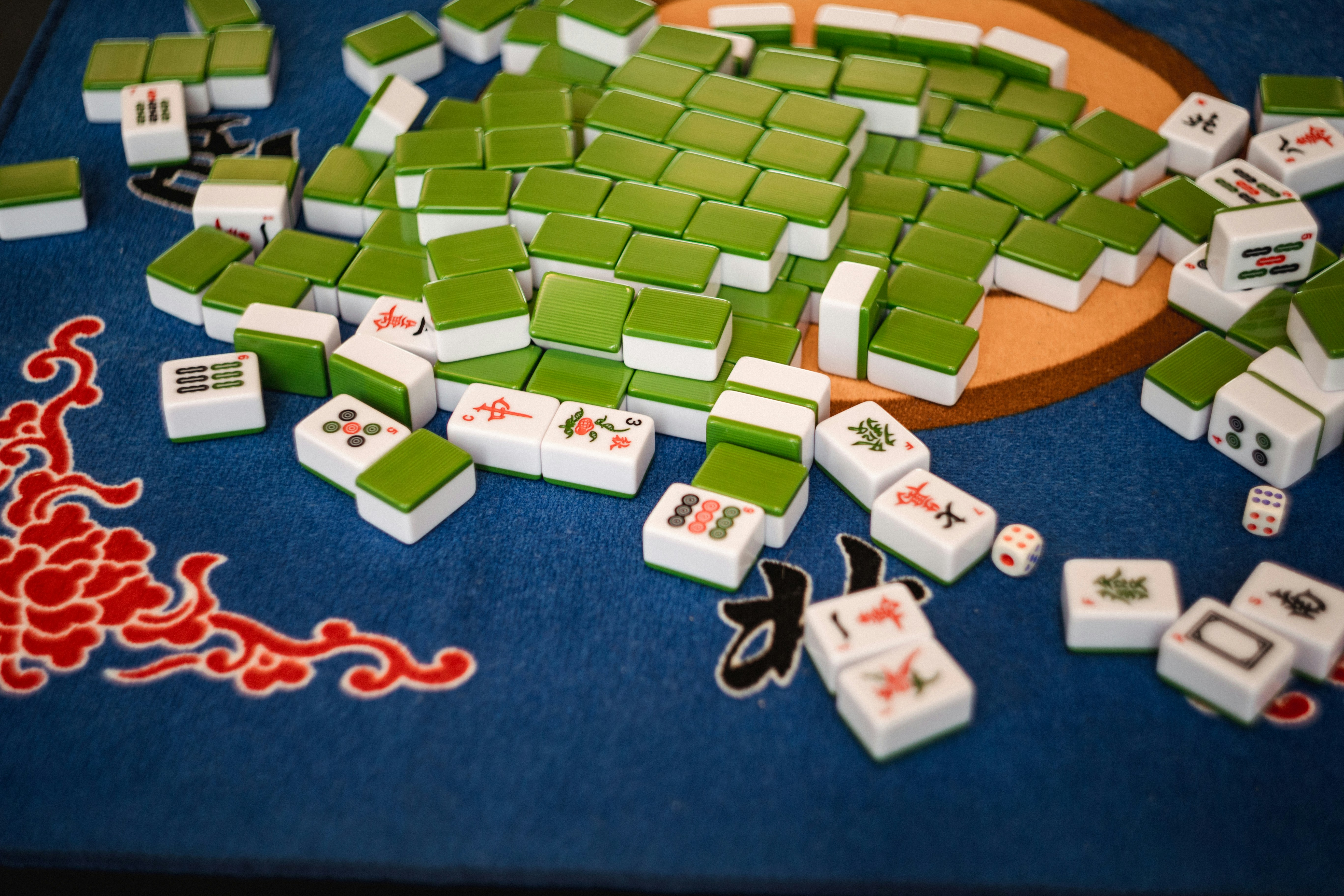 Strewn Mahjong Tiles at the Edge of the Green Tile Forest