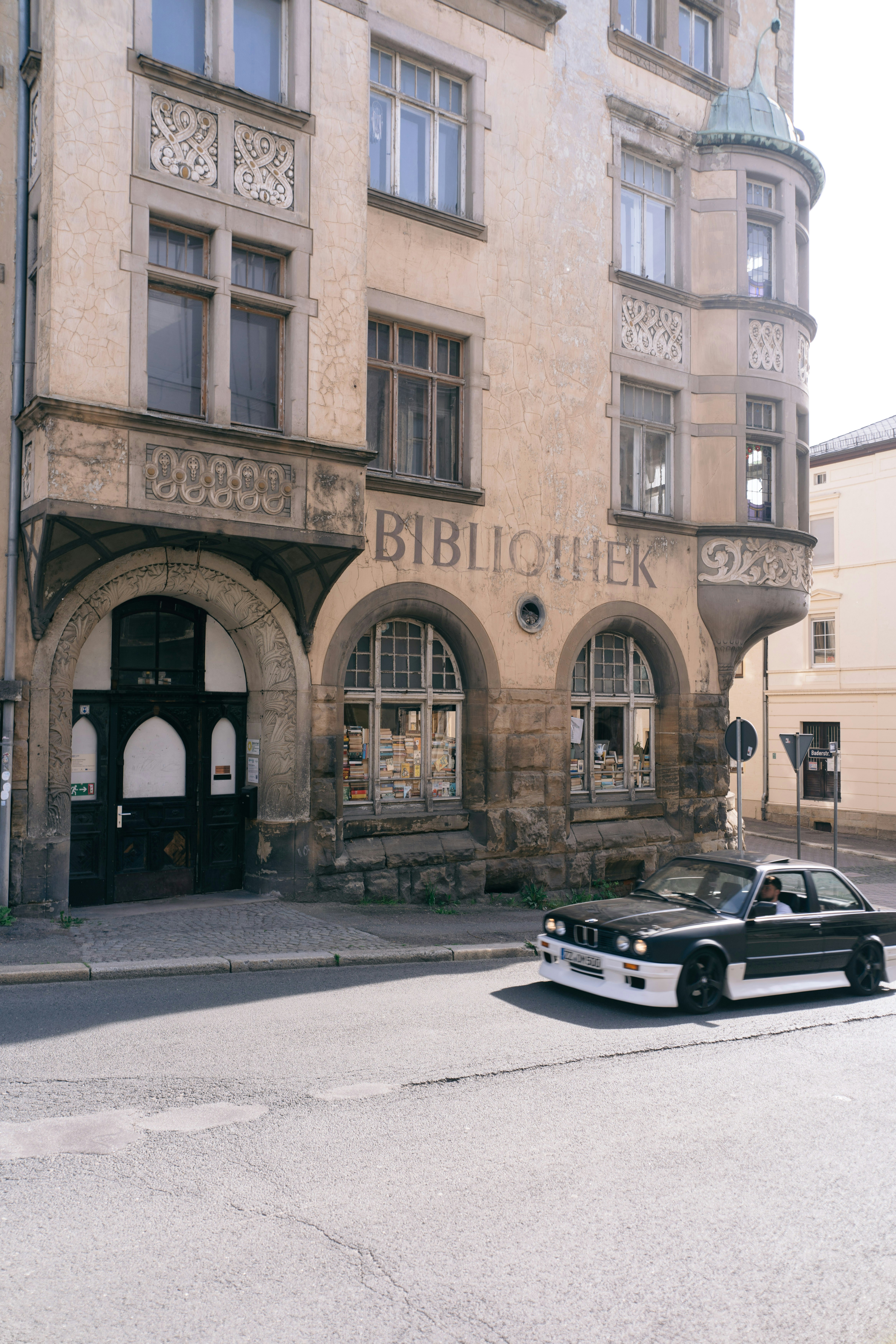 Historic Library Facade with Curved Turret and Street Perspective