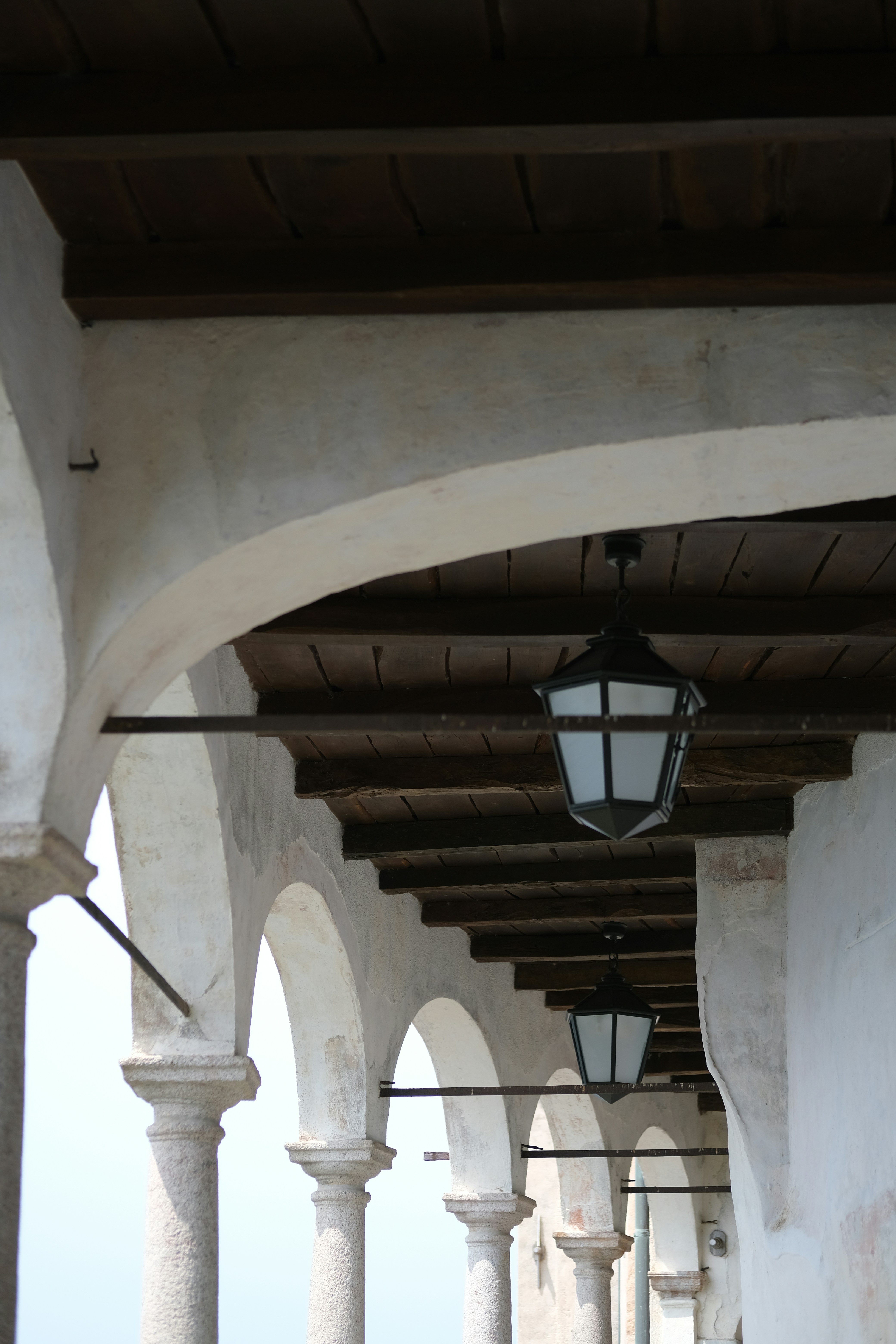 Arcade of Lanterns: A Corridor of Light and Stone