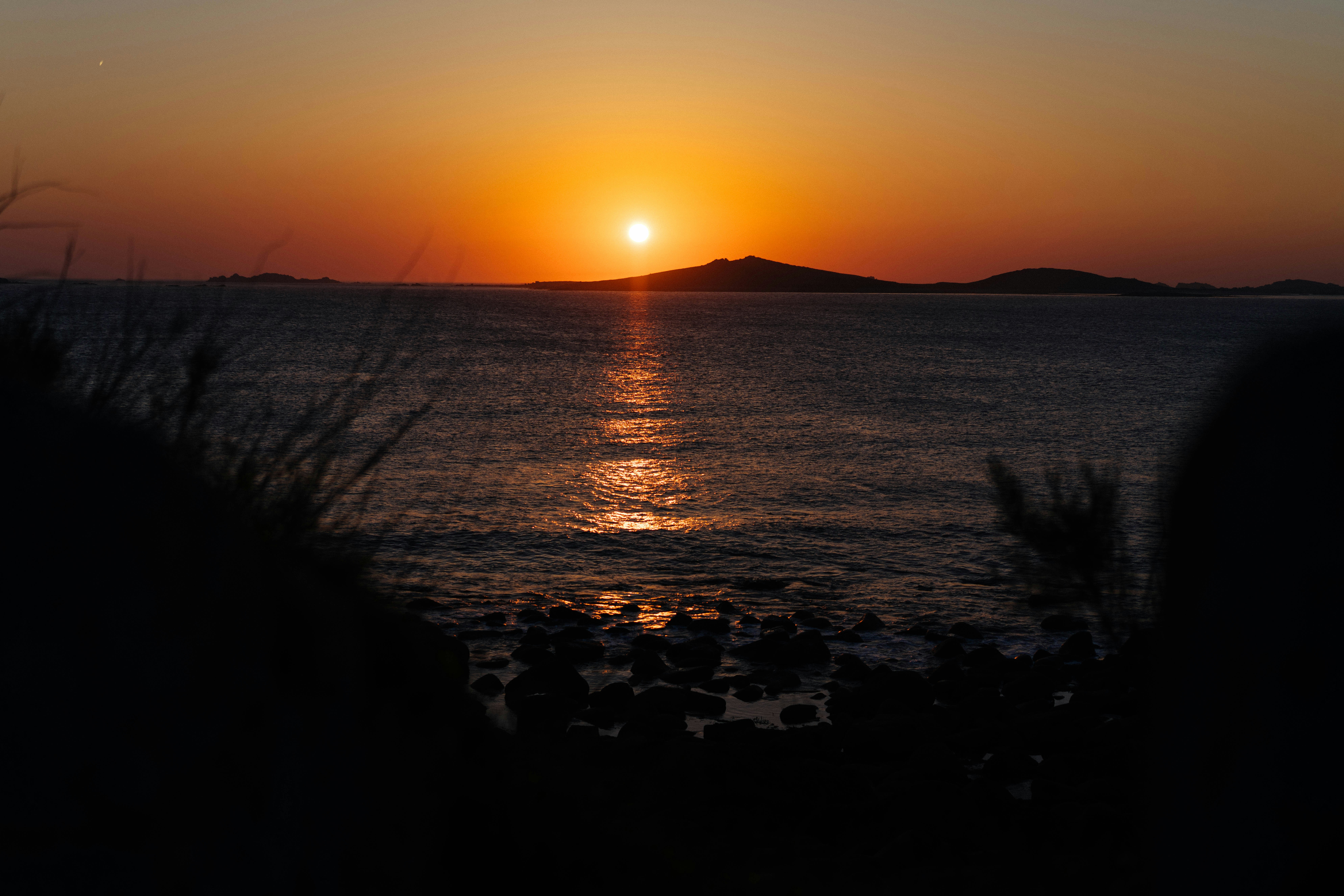 Sunrise Slipstream: Horizon Fire over Quiet Seas