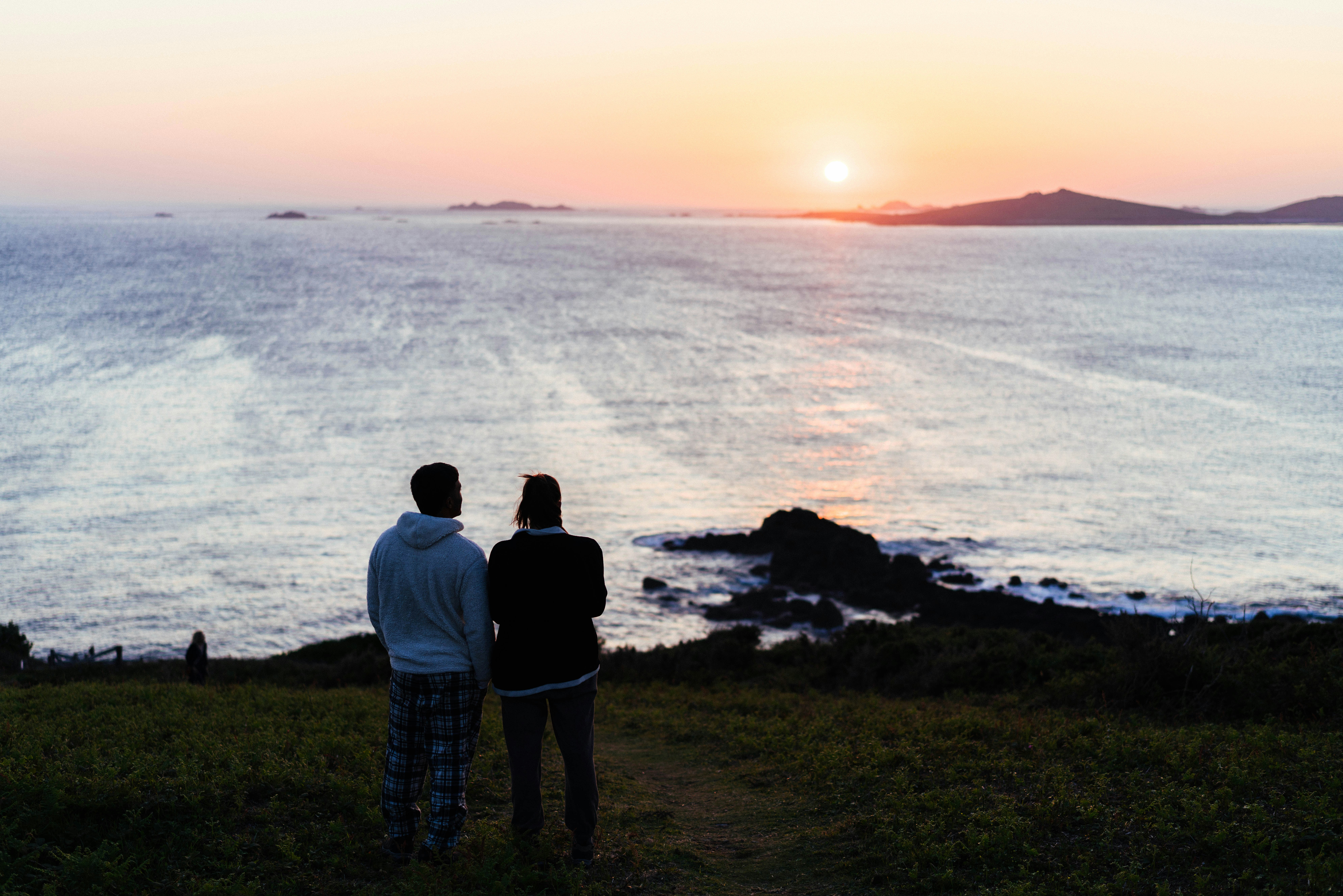 Sunset Moment: Two Viewers Share a Quiet Horizon