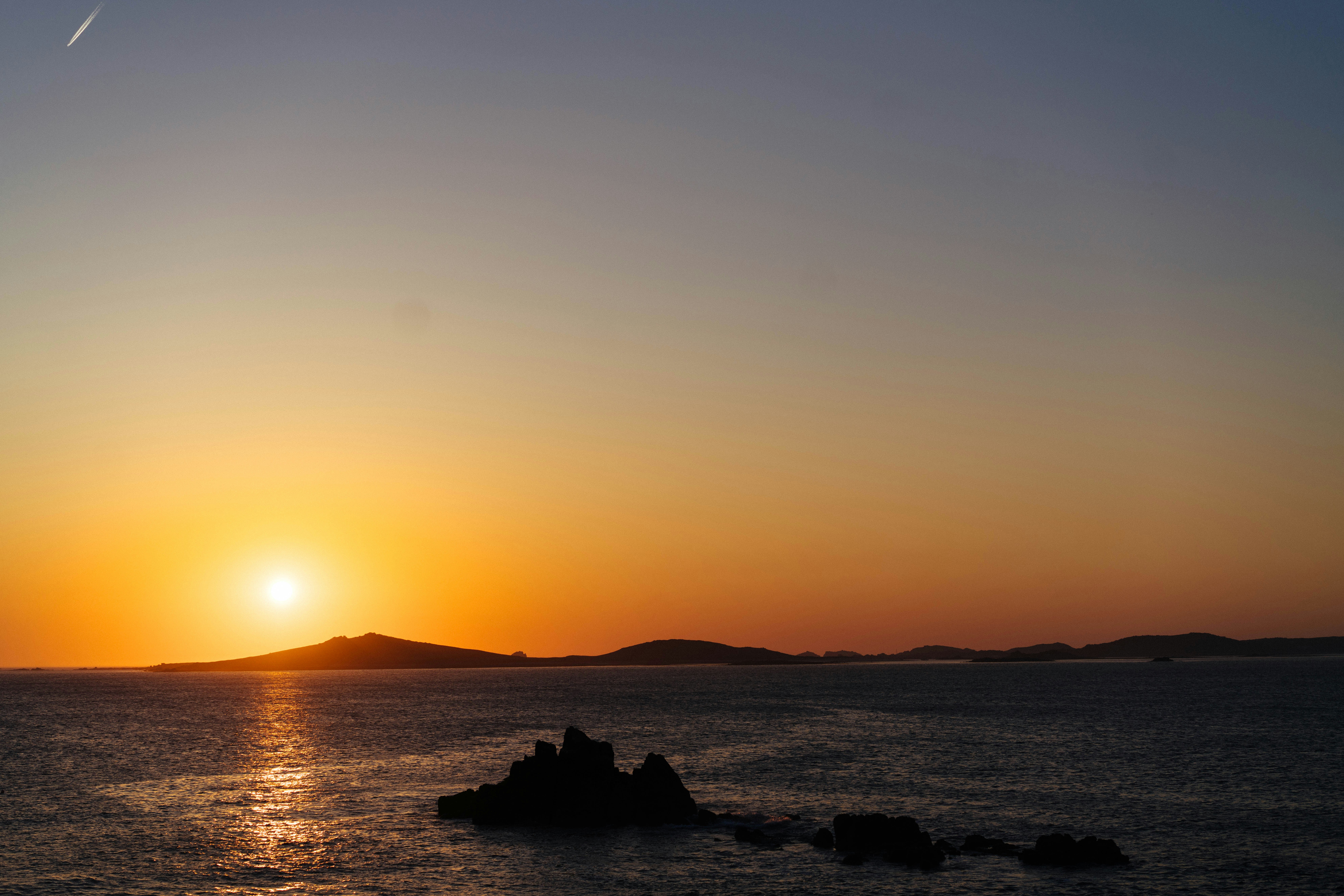 Sunset Ridge Over Calm Seas