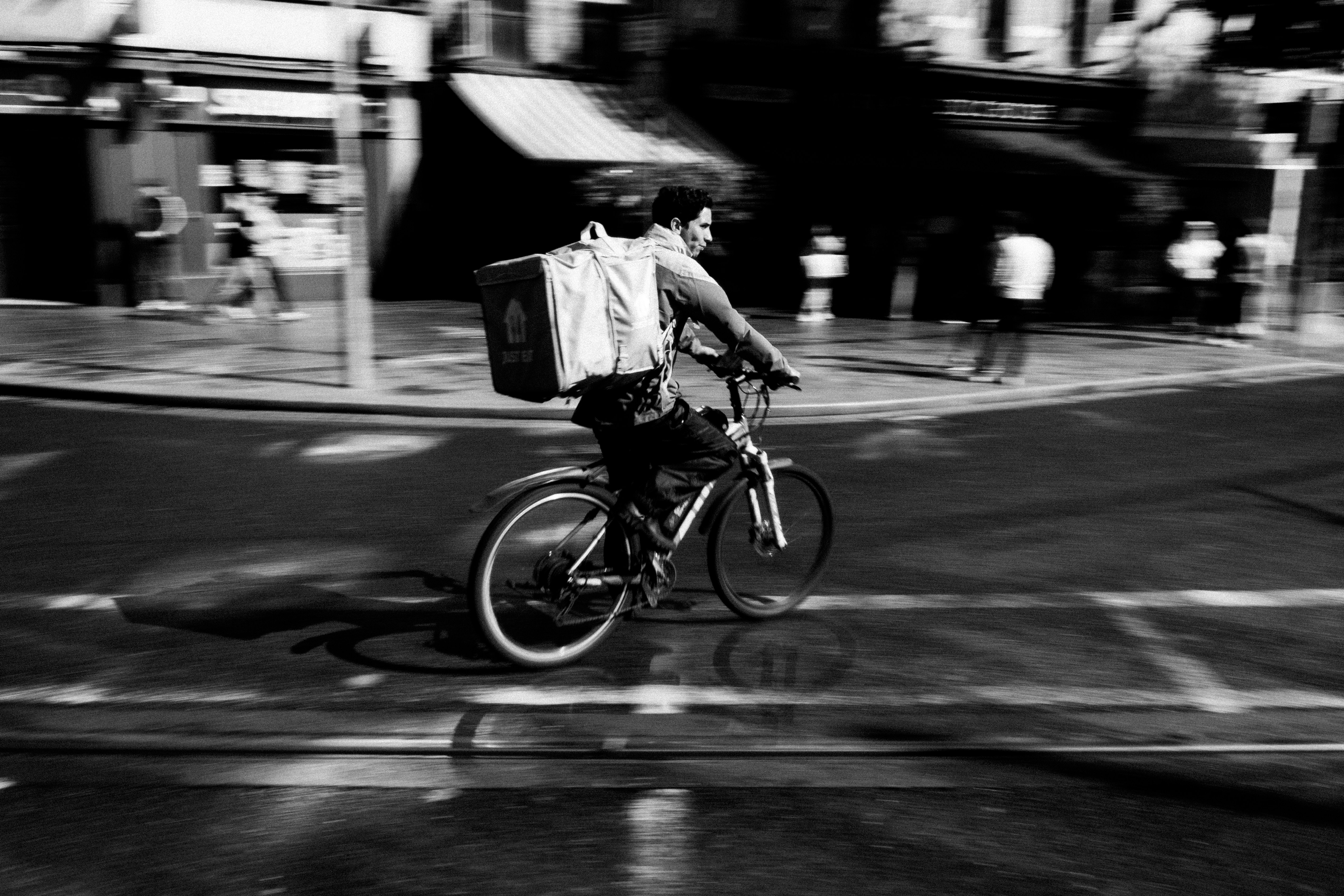 Delivery Cyclist in Motion: The City’s Quiet Blur