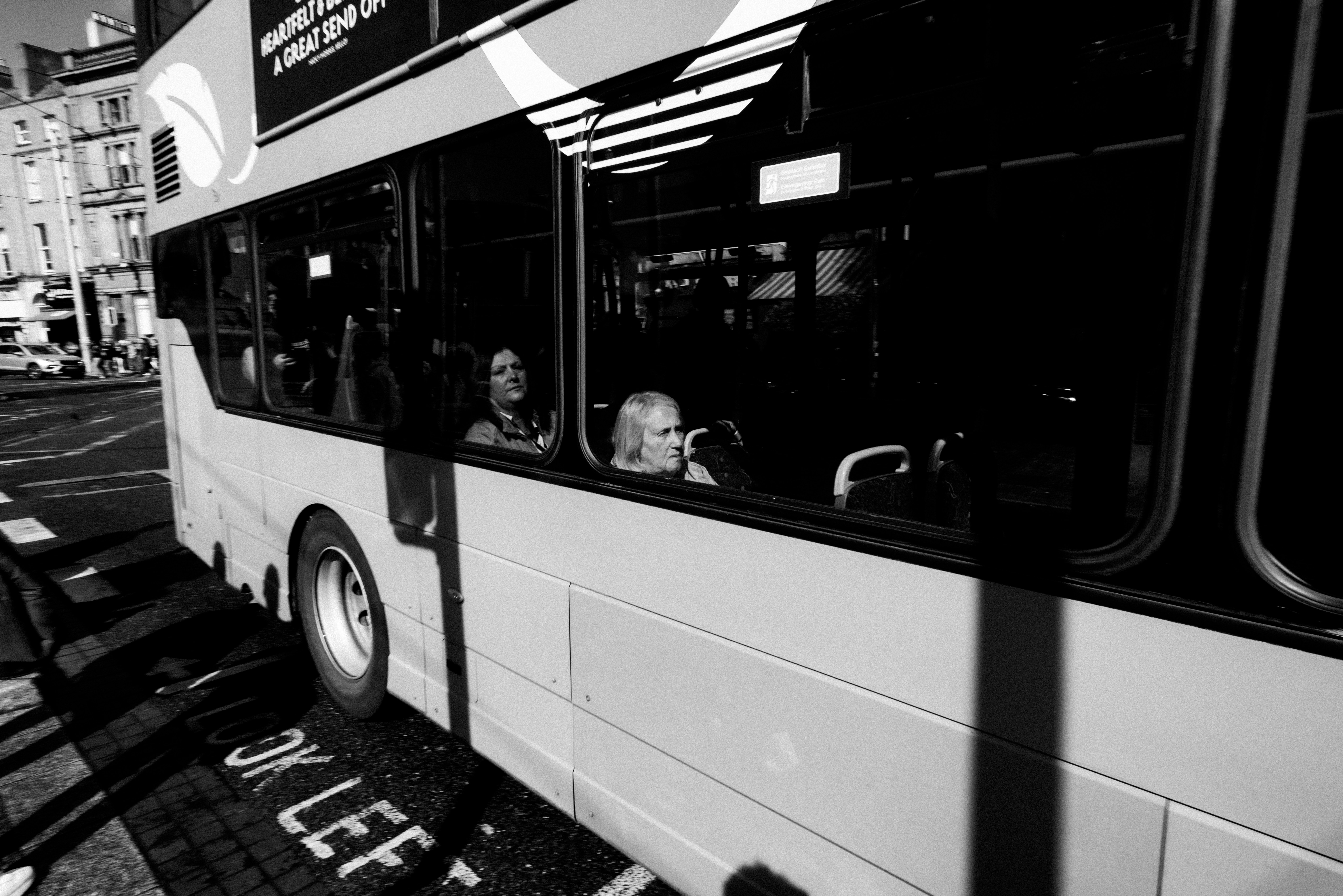 Passengers at a City Bus Window: A Study in Urban Quiet