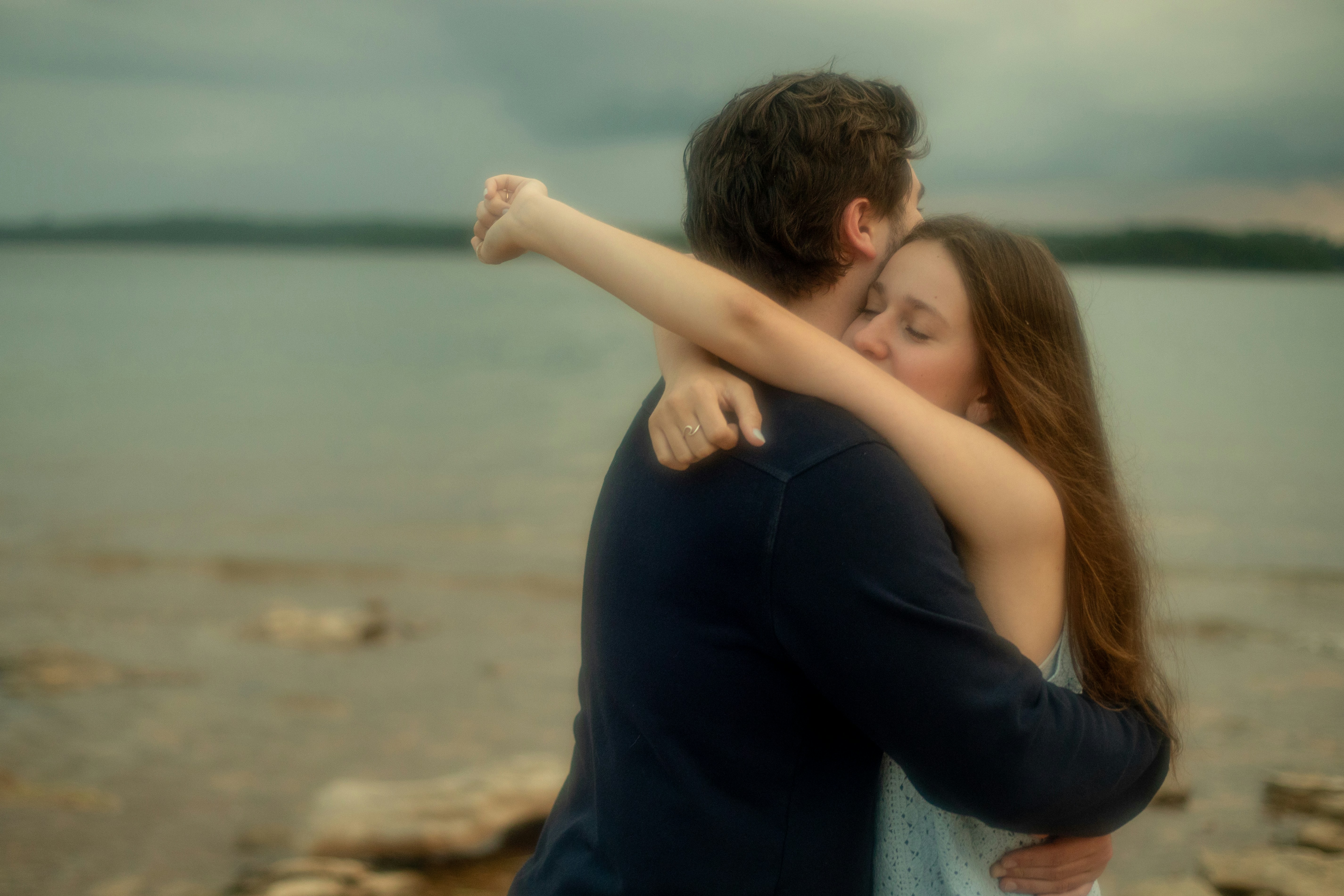 Embrace by the Lake: Quiet Comfort in a Shared Moment