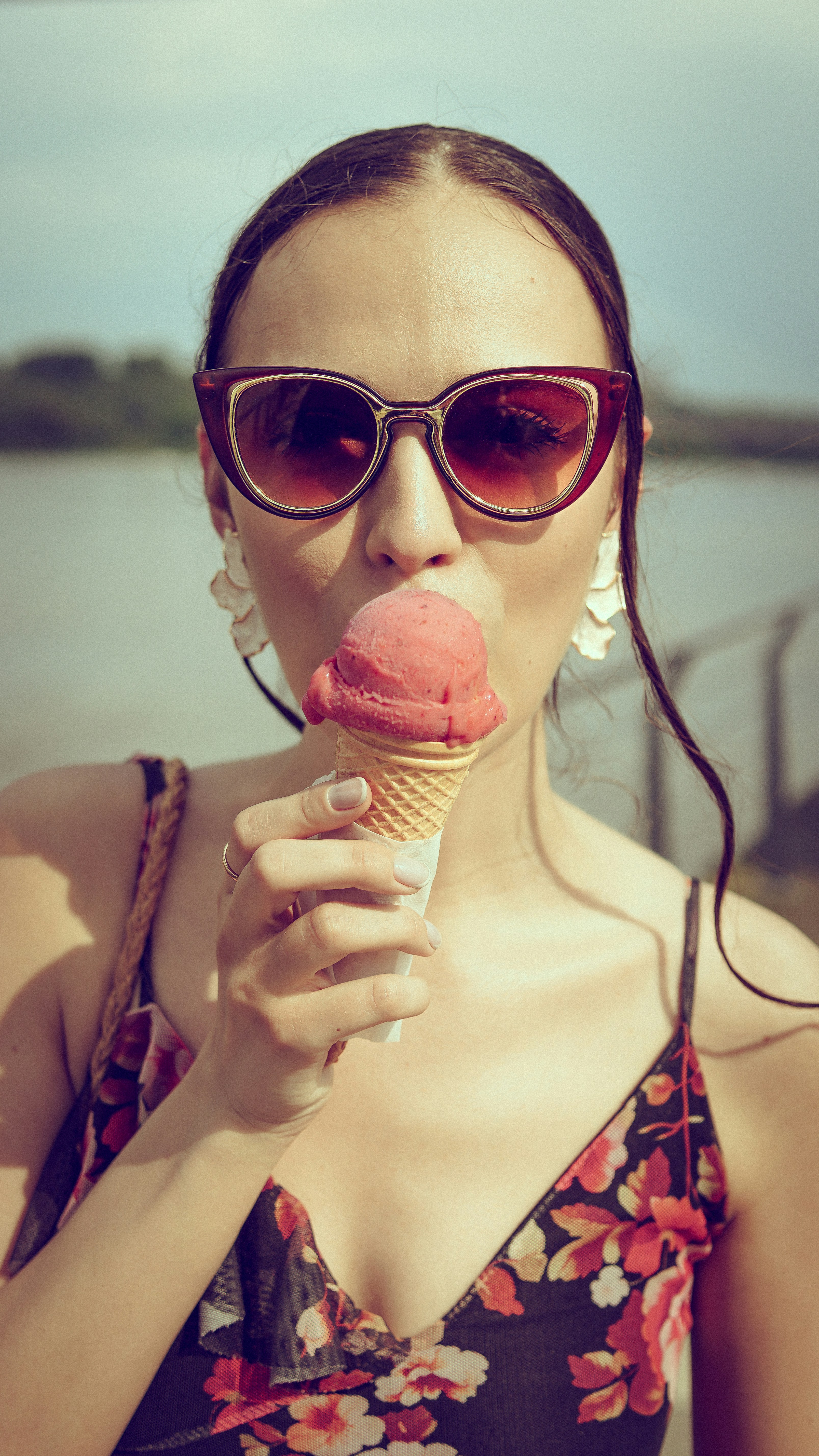 Sun-kissed Glaze: A Sunglasses-Clad Moment with Raspberry Ice