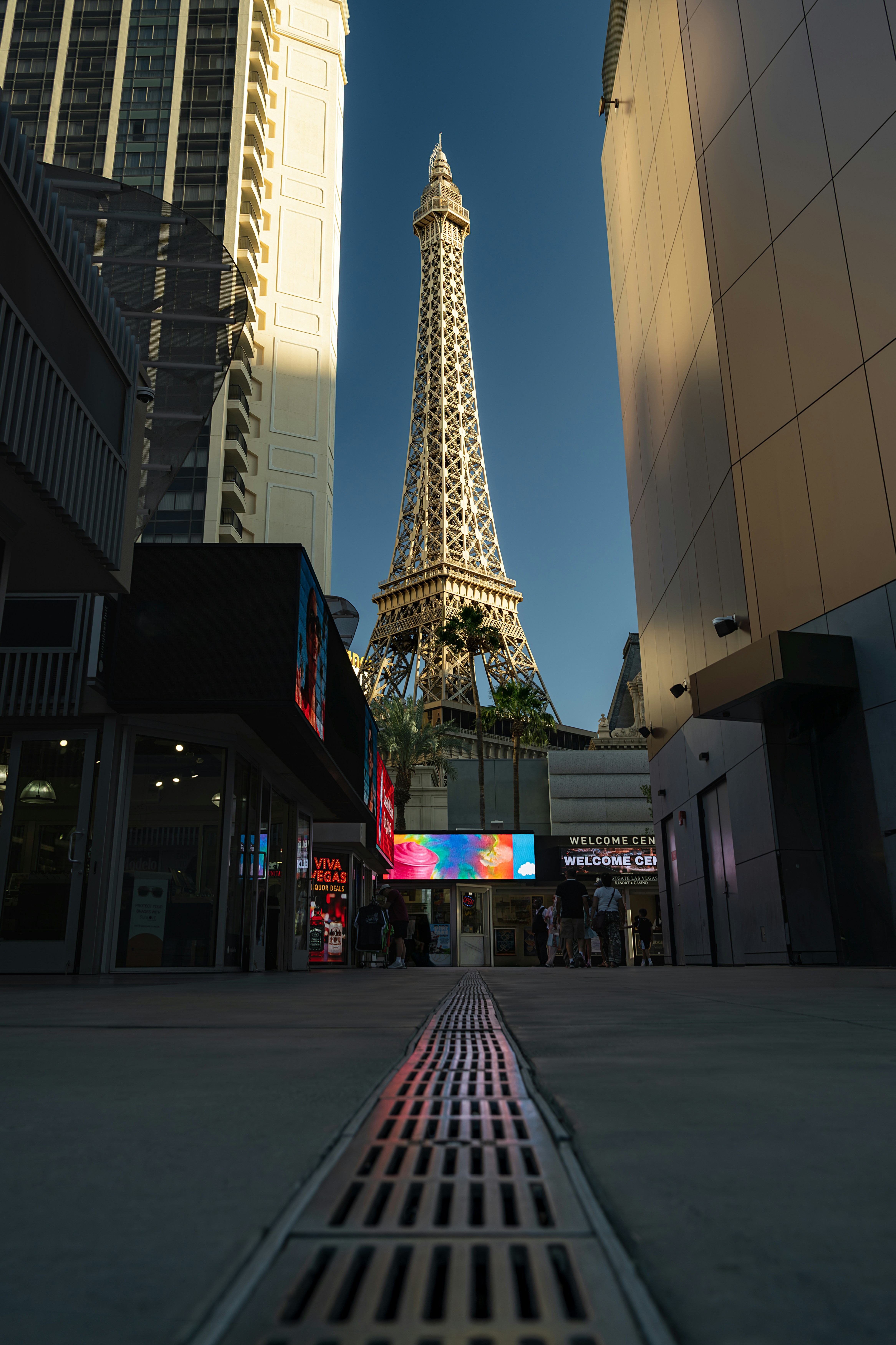 Towering Icon: The Eiffel-like Spire Framed by Urban Canvases