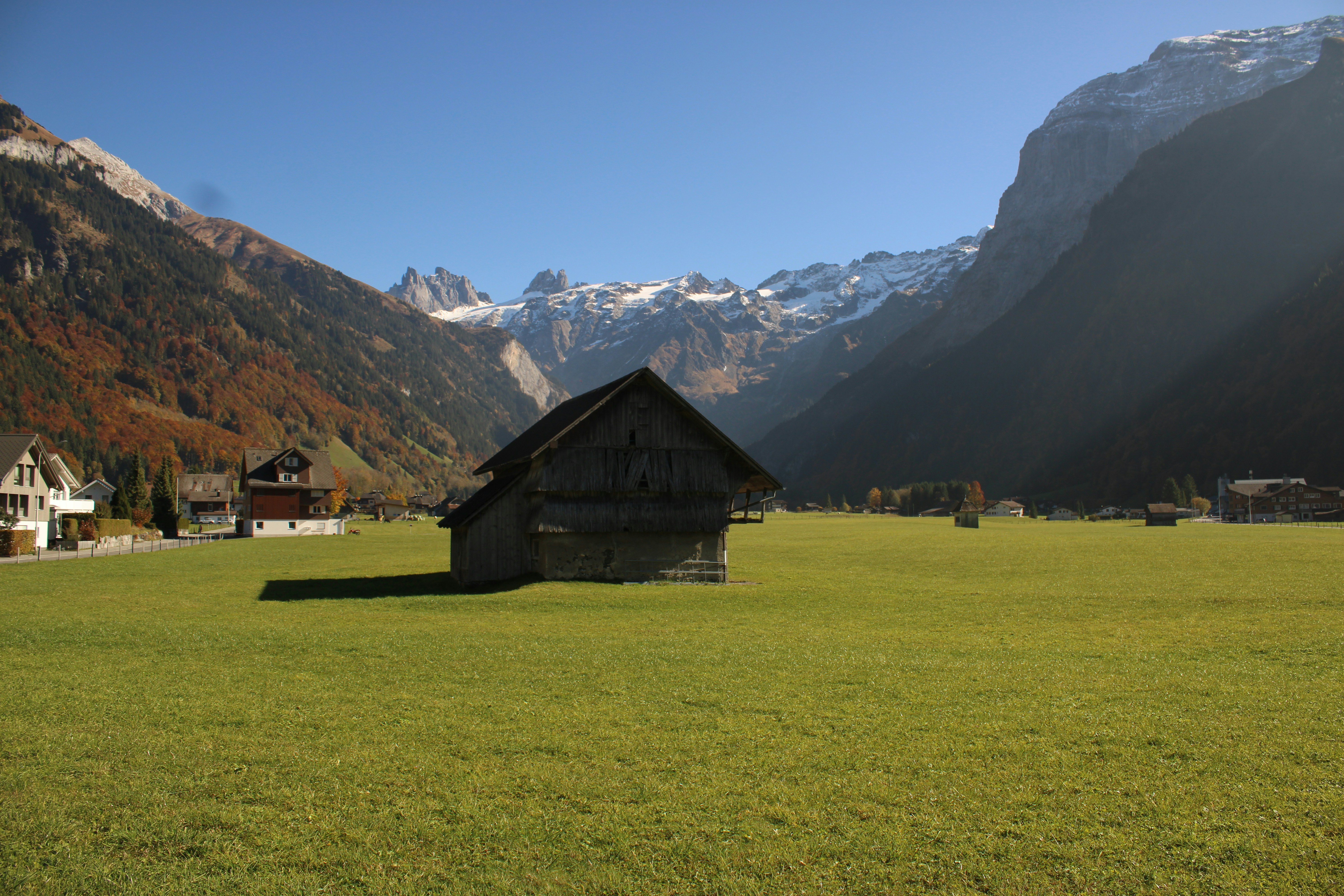 Lonely Barn at the Foot of Icy Peaks