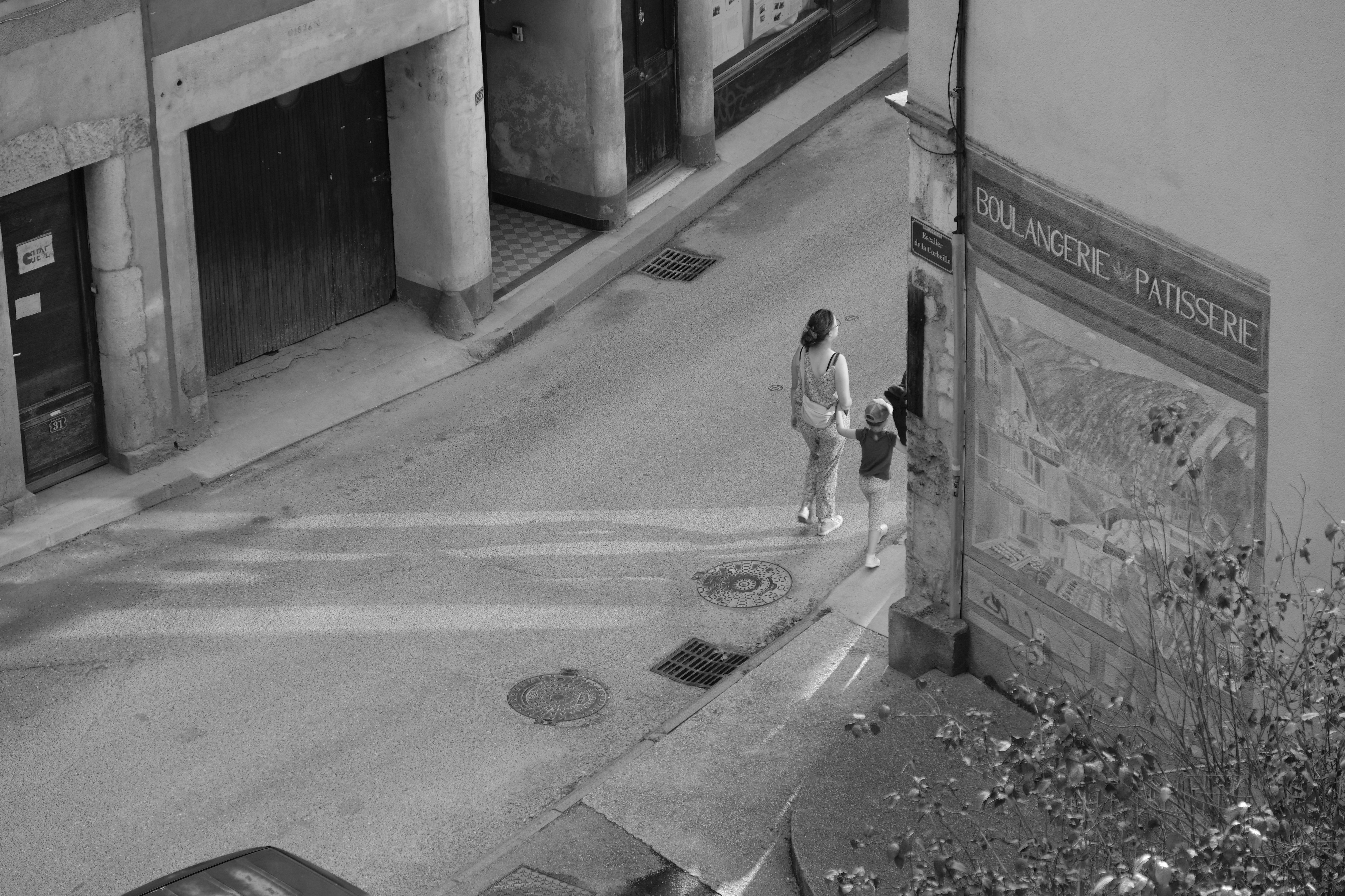 Crossing Paths: A Quiet Moment on a Narrow Street