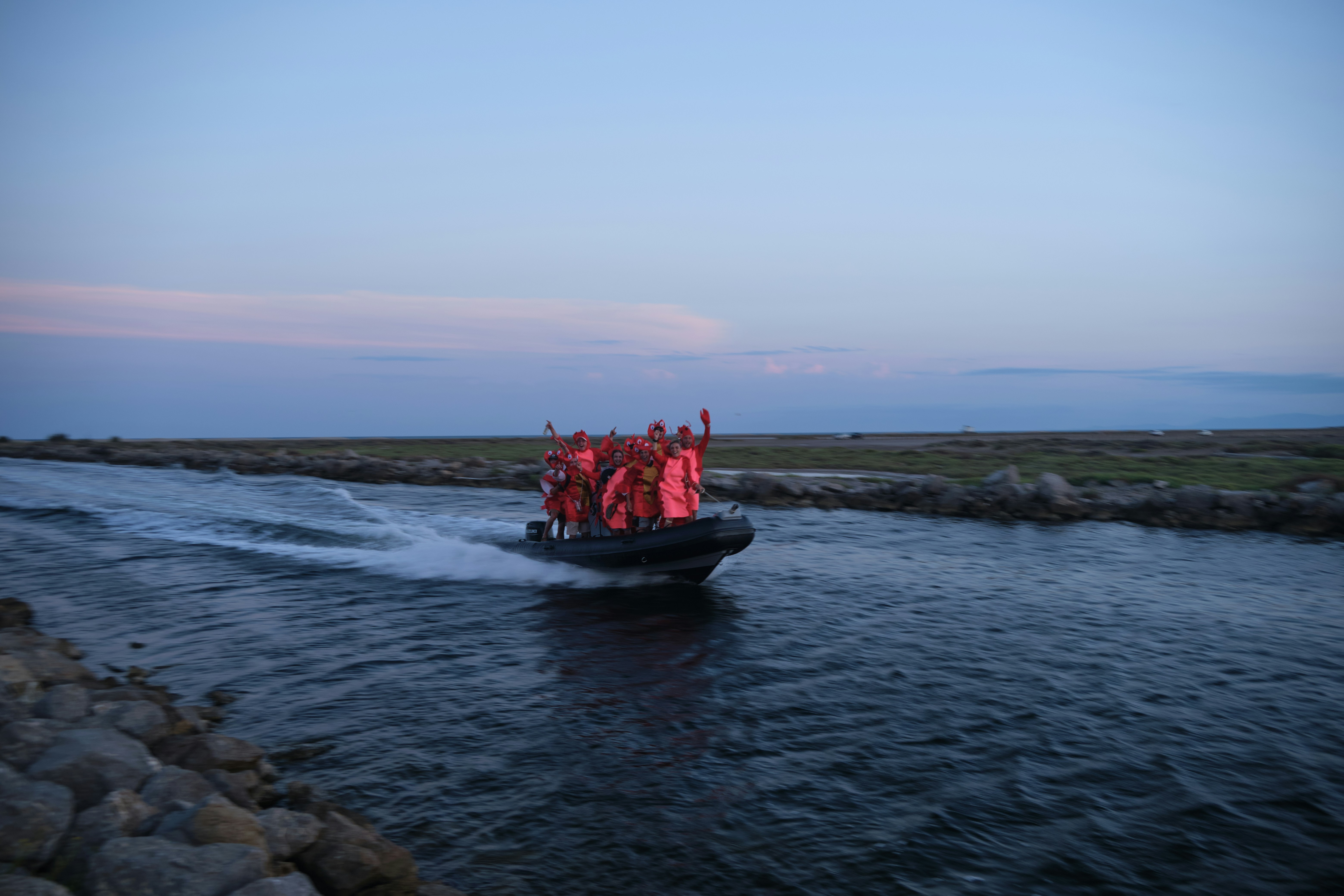 Runners in a Coastal Wake: Nightfall Boat Parade