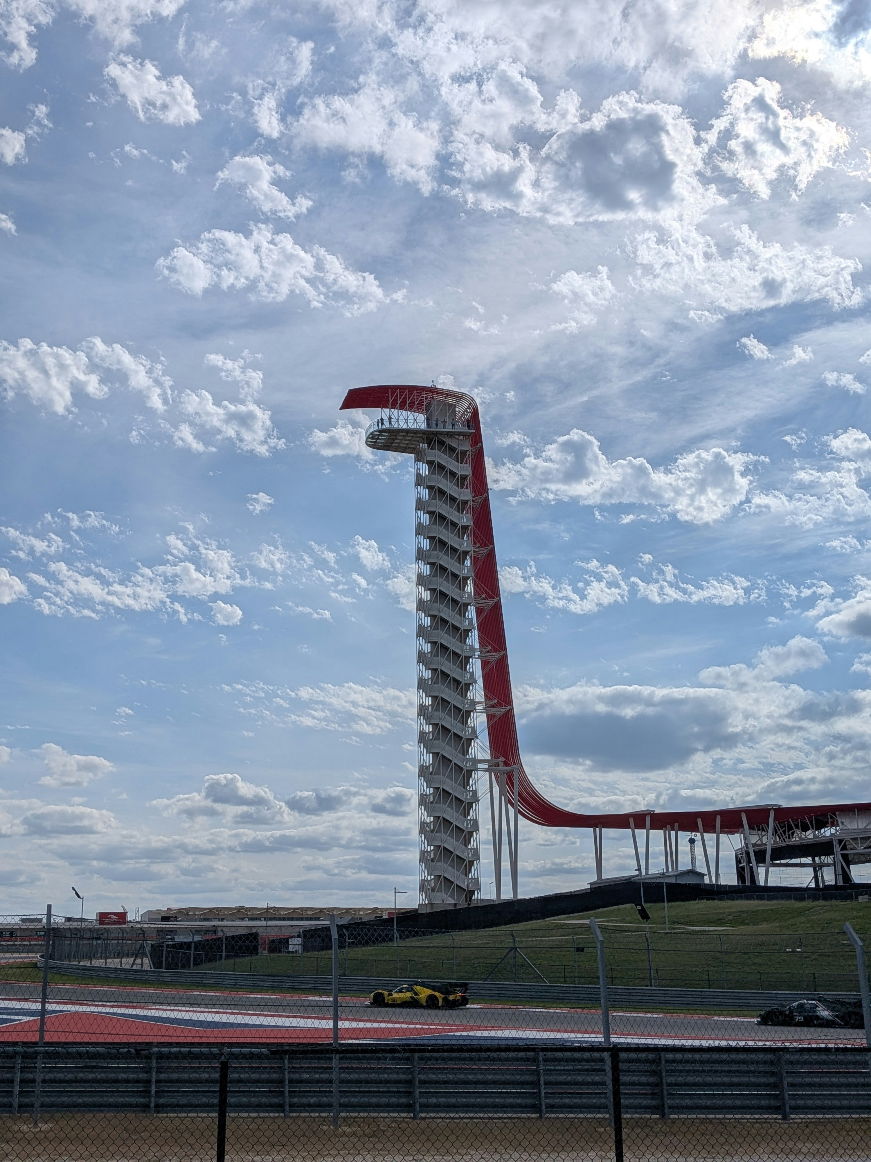 The Red Ascender Over Racing Sky