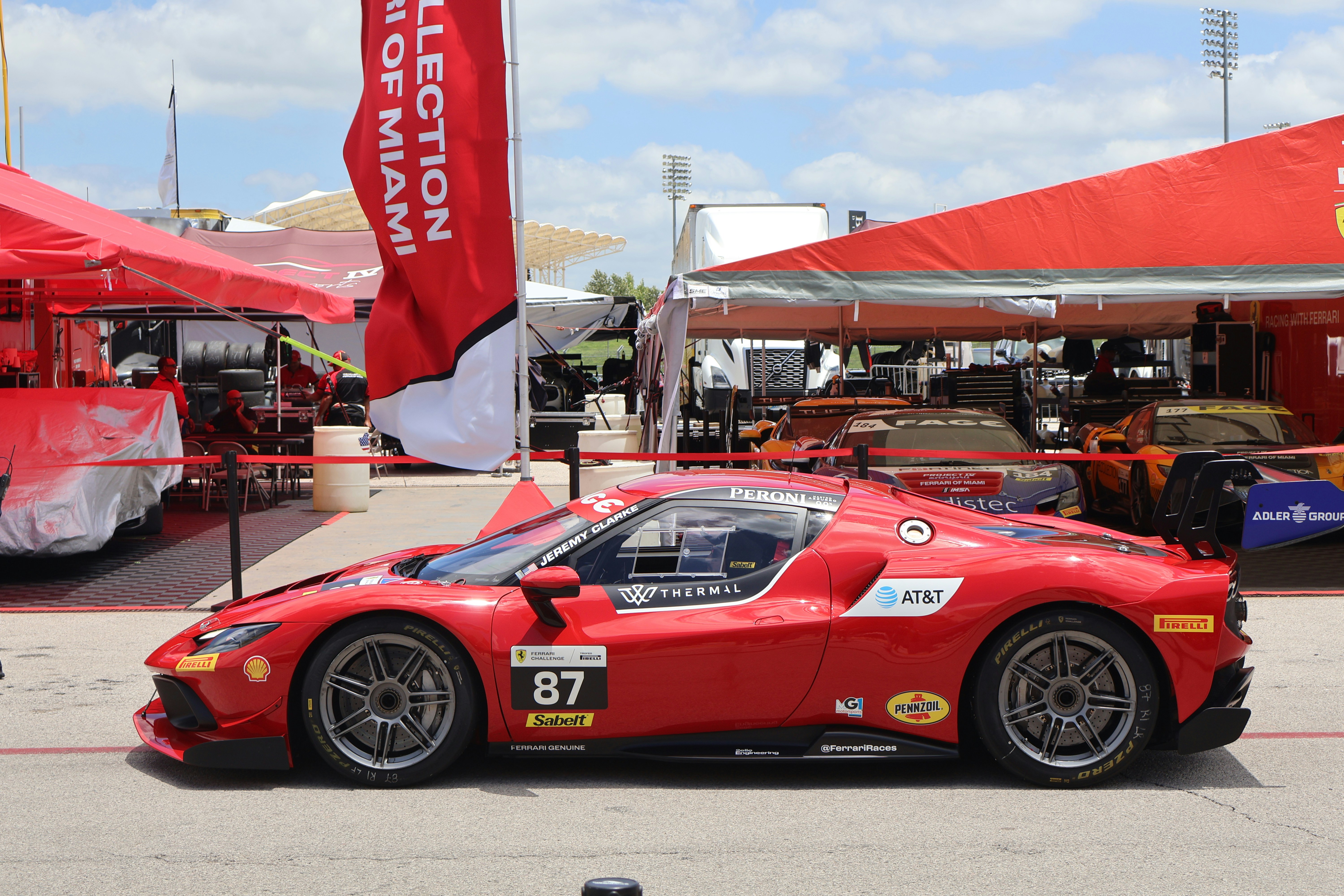 Red Protagonist at Paddock: A Racing Mustang in Sharp Focus