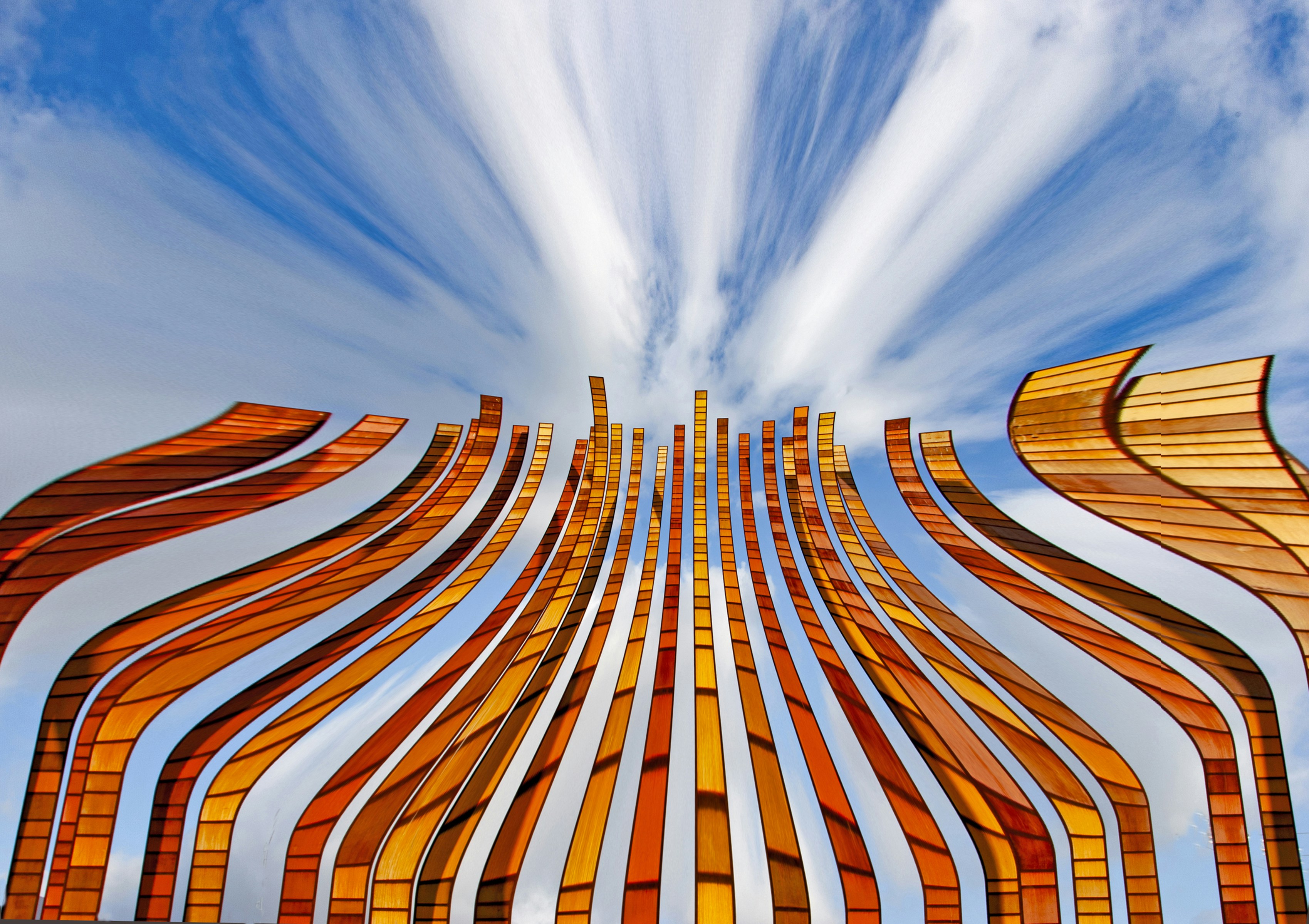 Radiant Ribbons: A Skyline of Woven Steel