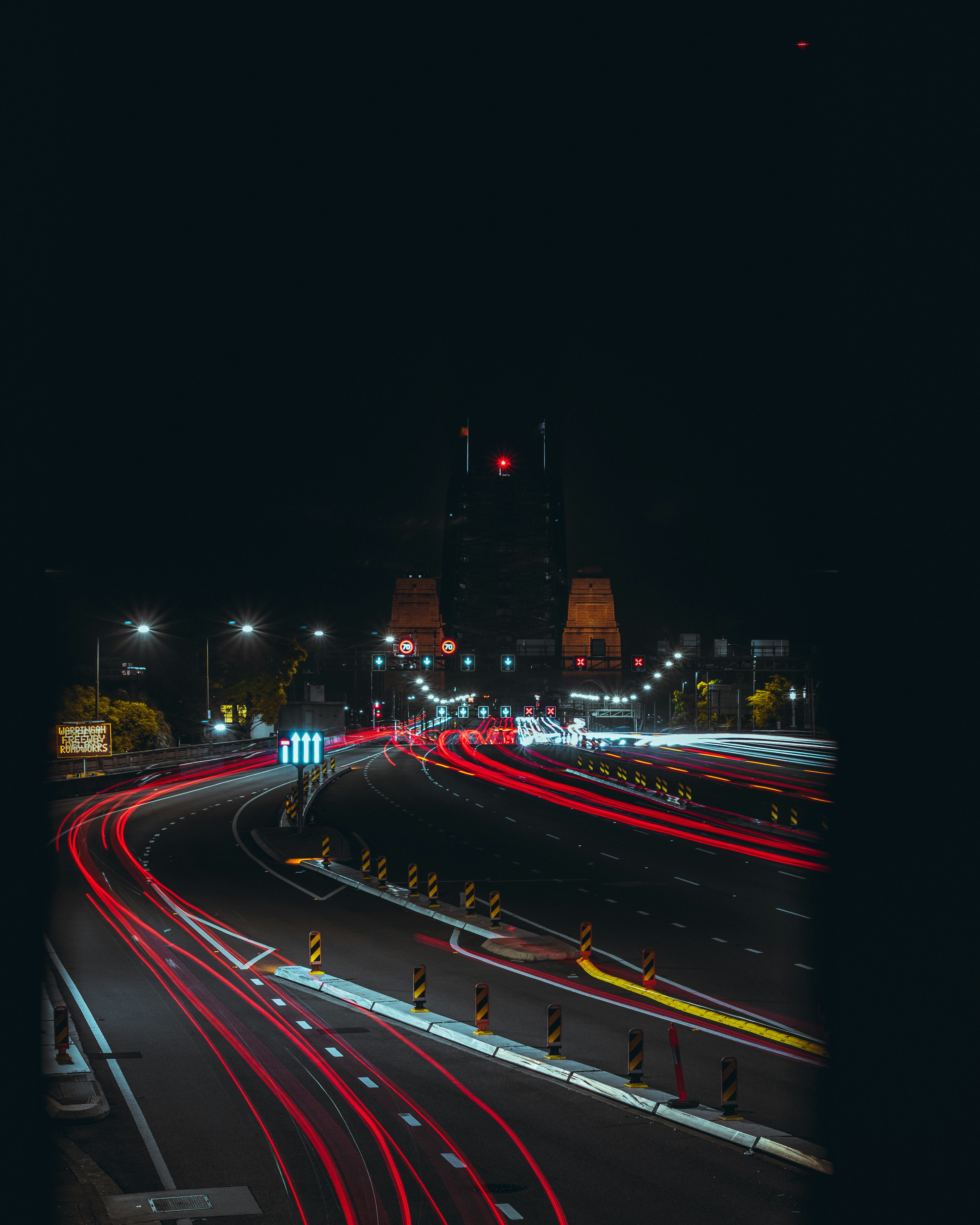 Neon Arches: Night Traffic Sculpted by Light Trails