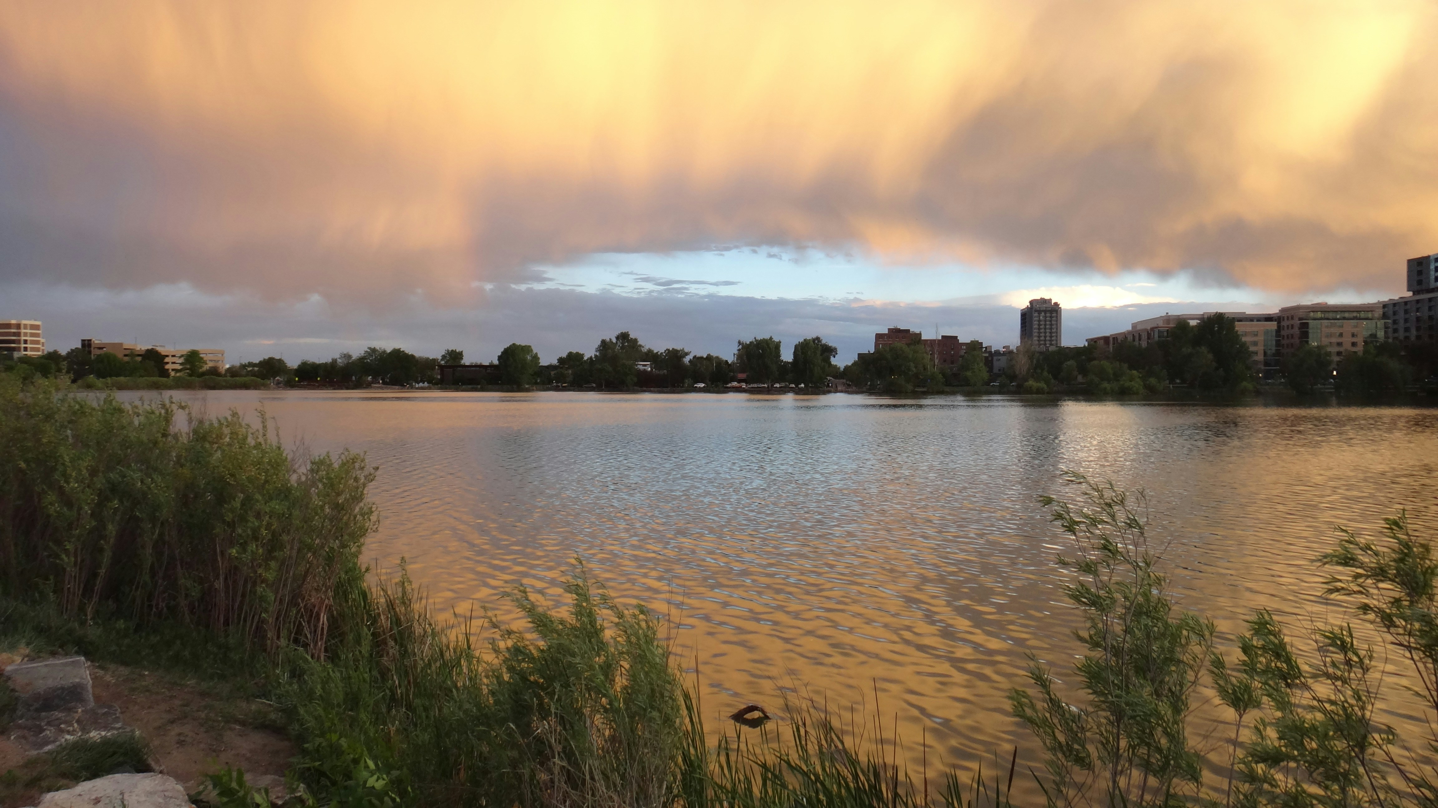 Golden Hour Over the River: City Silhouette at Sunset