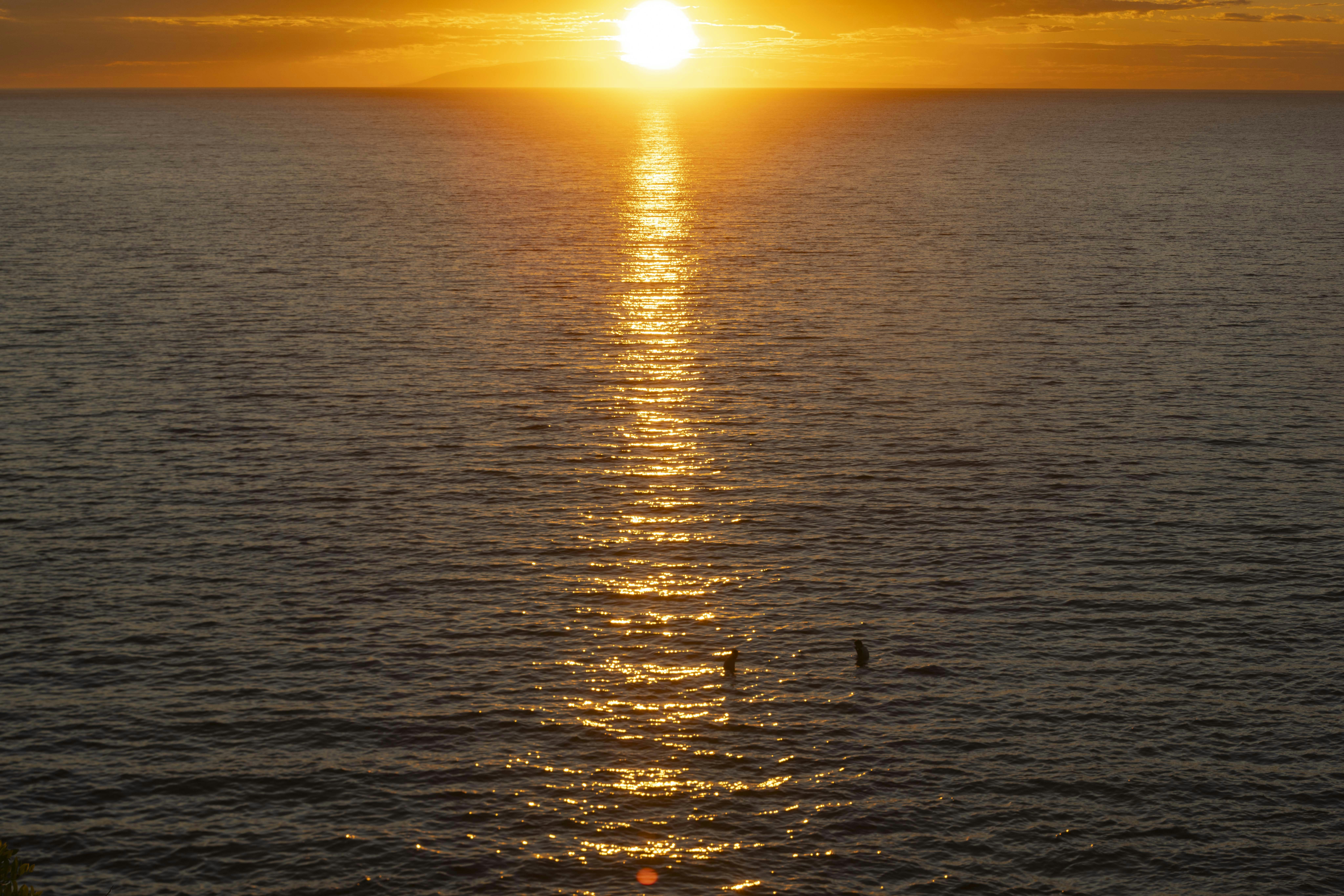 Sunlit Path: The Golden Vertical across a Calm Sea