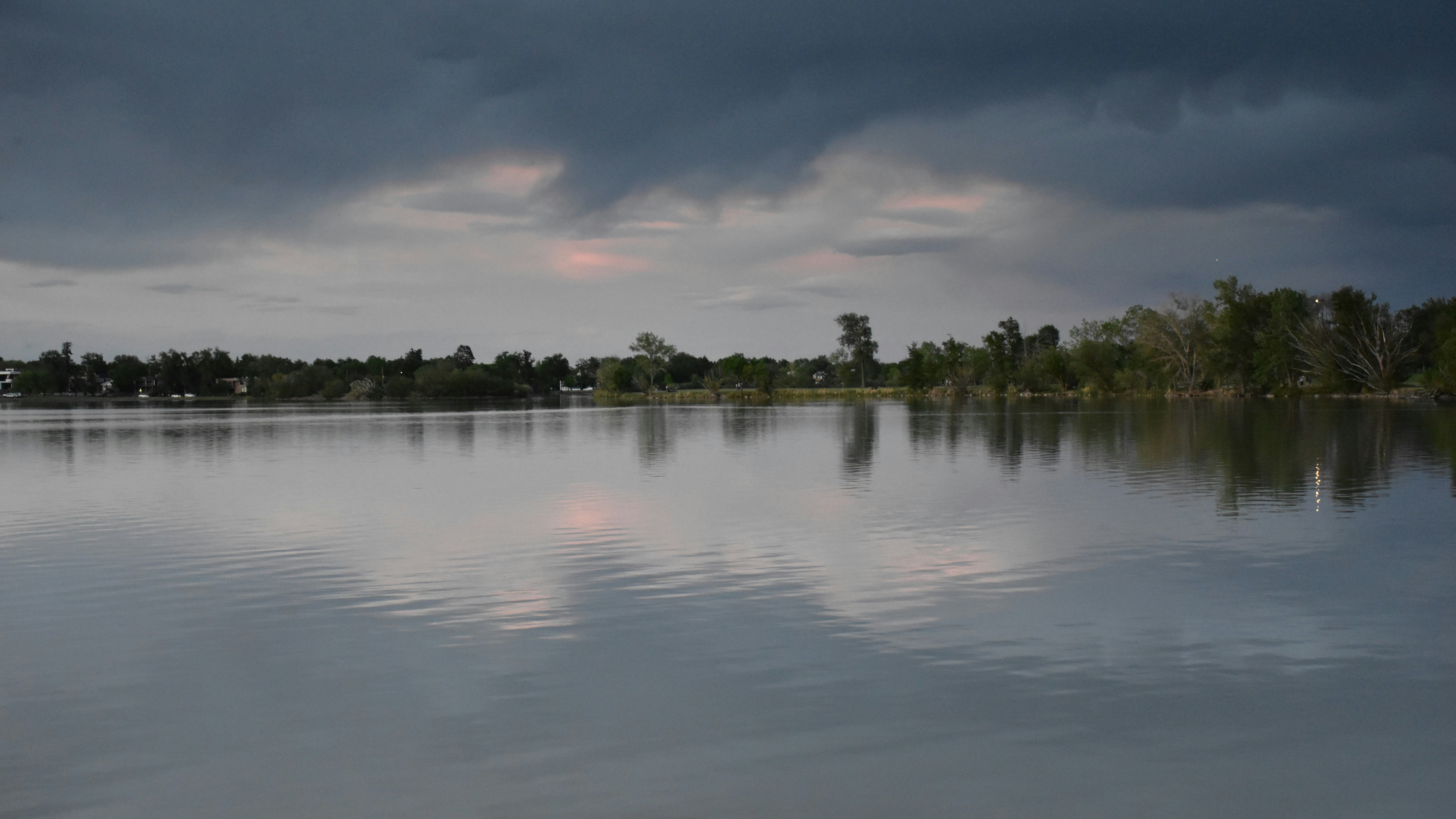 Calm Waters at Dusk: A Lake Speaks in Reflections