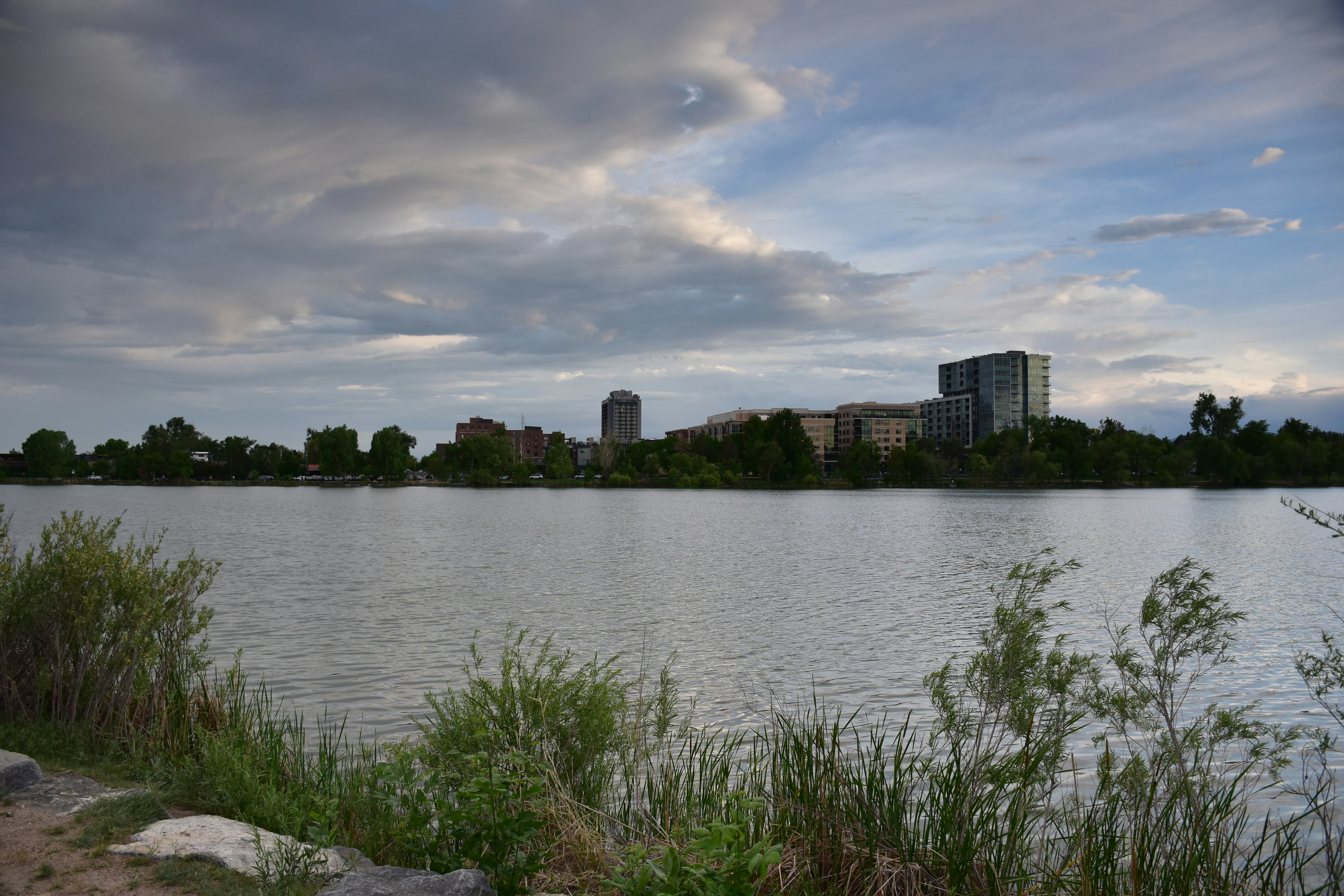 City Skyline Across a Calm River at Dusk