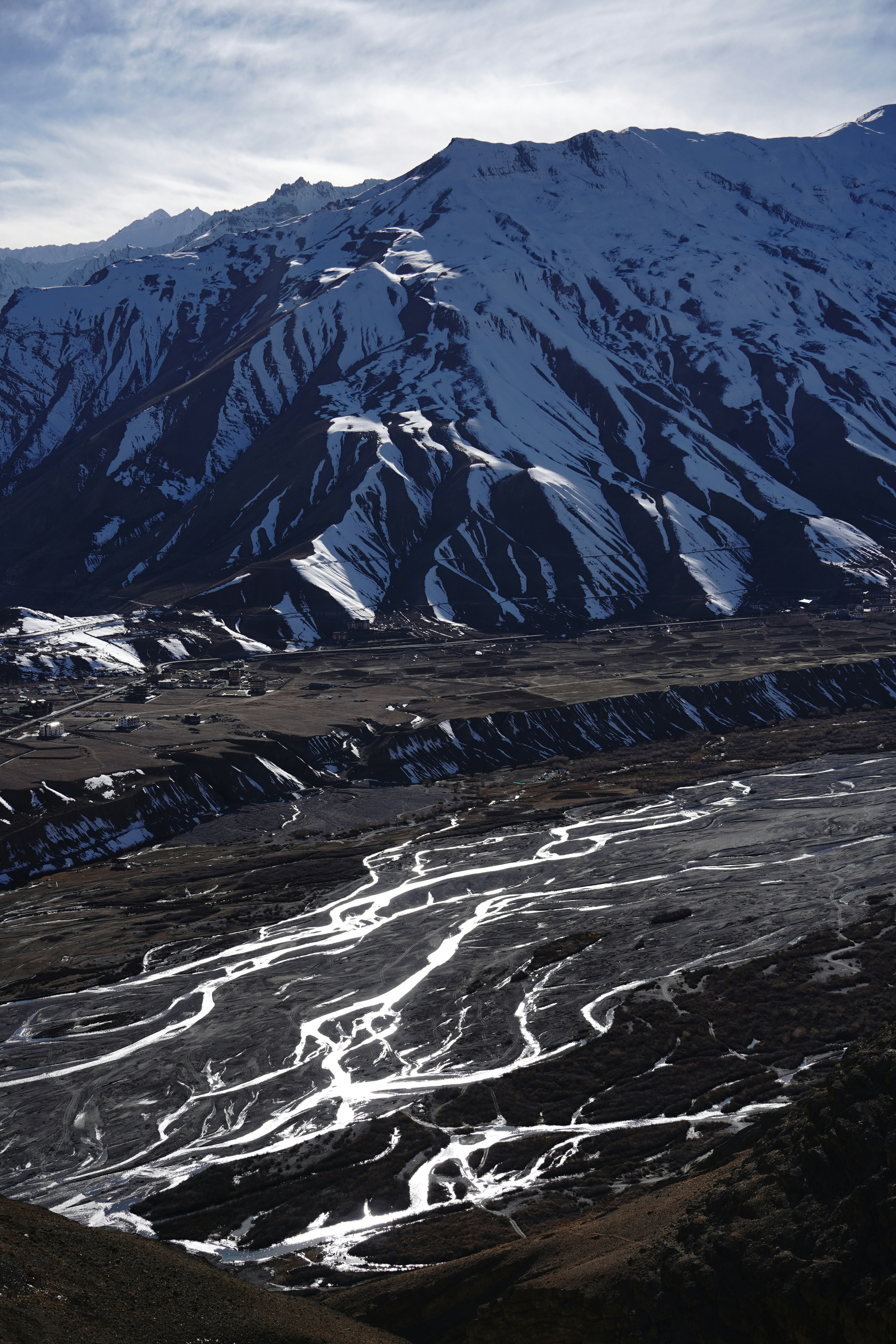 Snowbound Ridge: Light, Shadow, and Luminescence Over Alpine Tiers