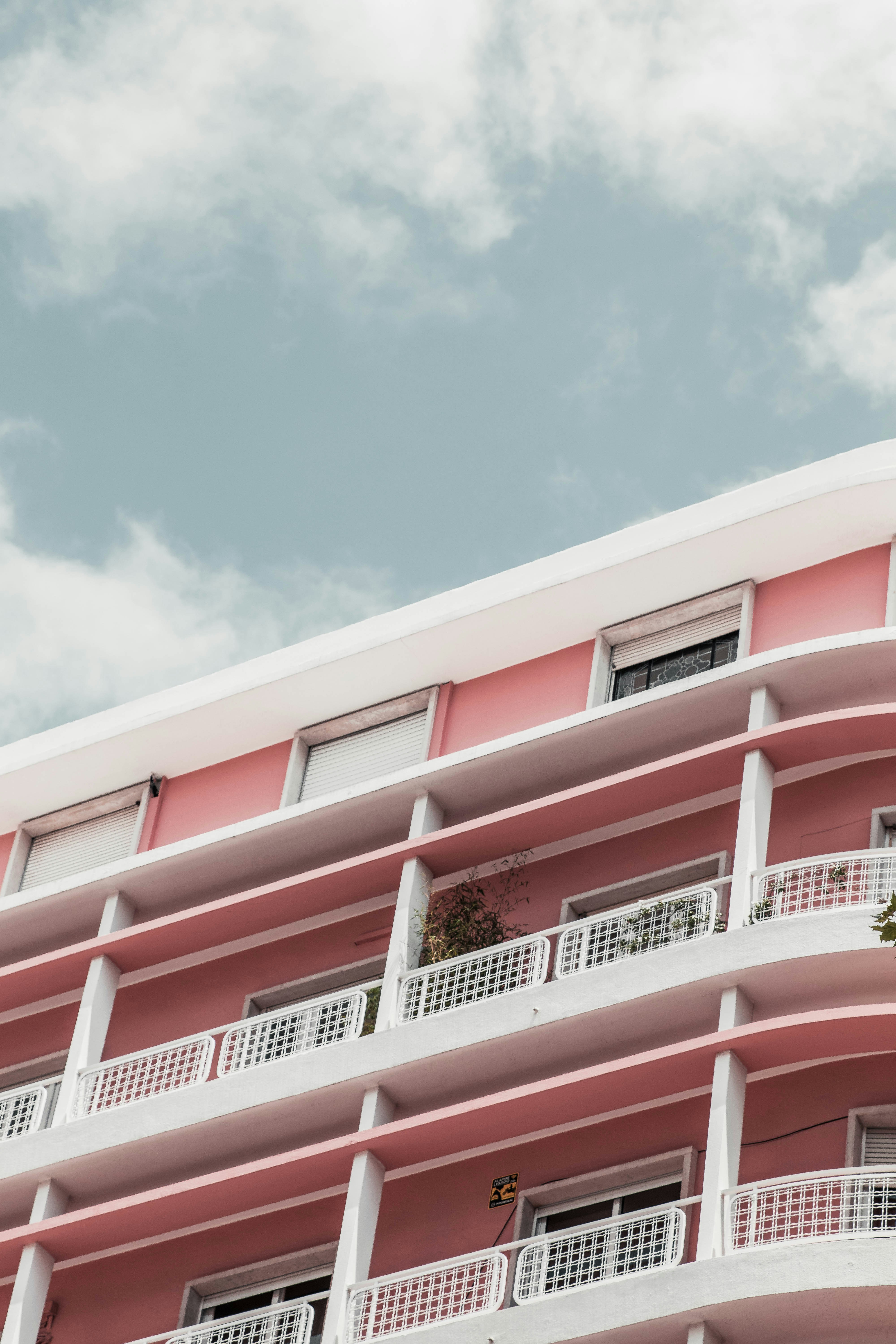 Pink Apartment Arches under a Powder Blue Sky