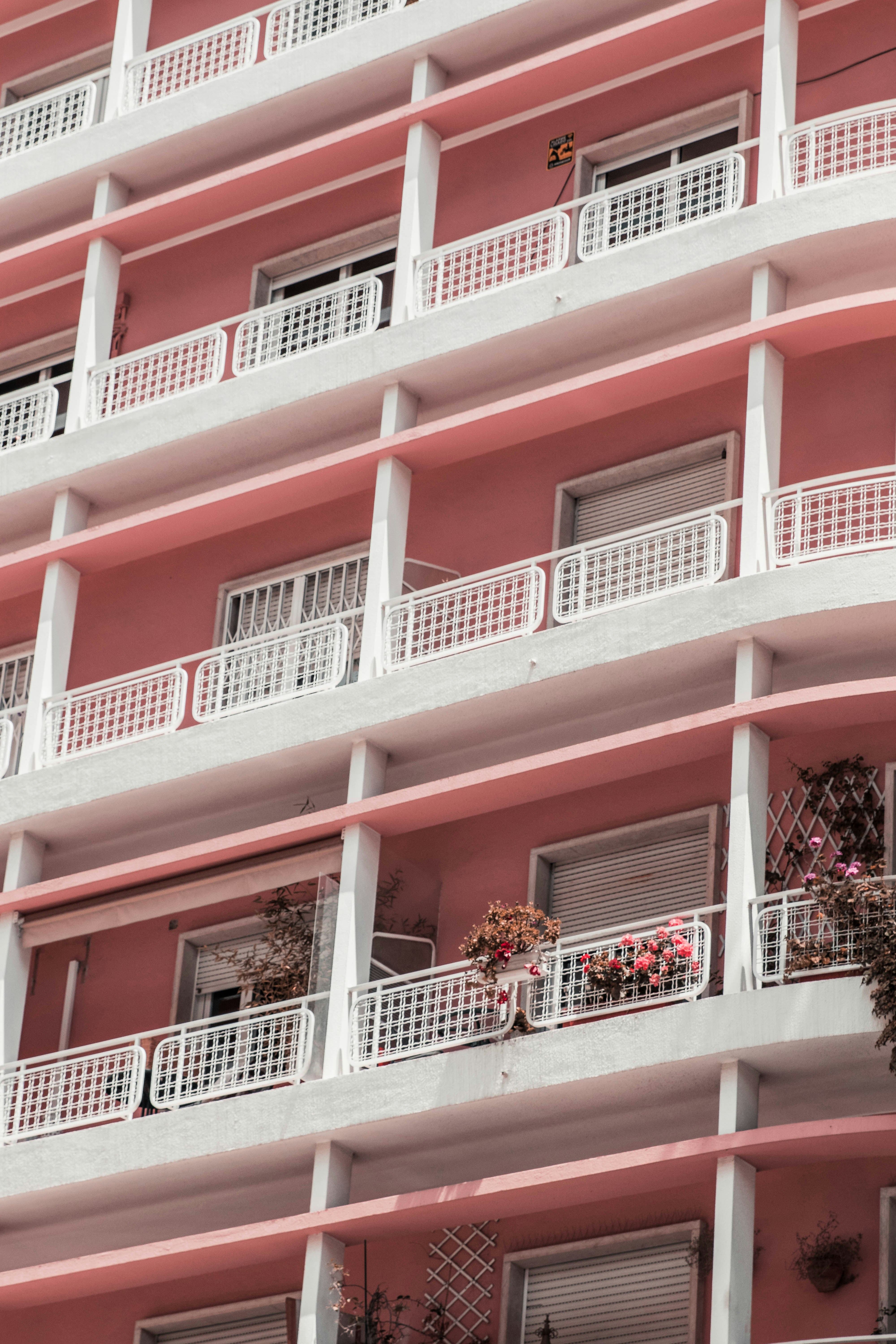 Rosy Balconies: A Vertical Reliquary of Quiet Urban Color